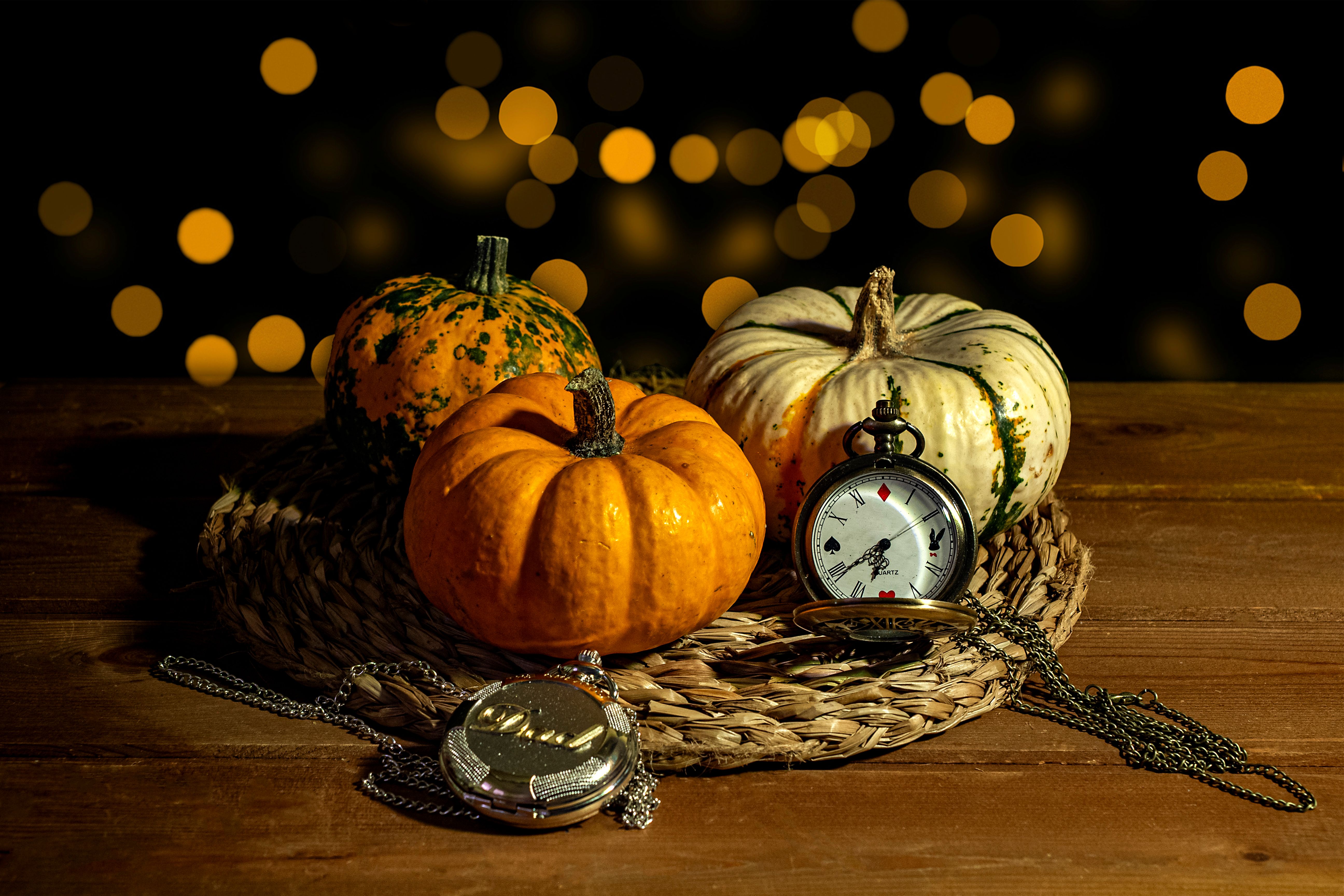 Pumpkins and Alarm Clock on Table · Free Stock Photo