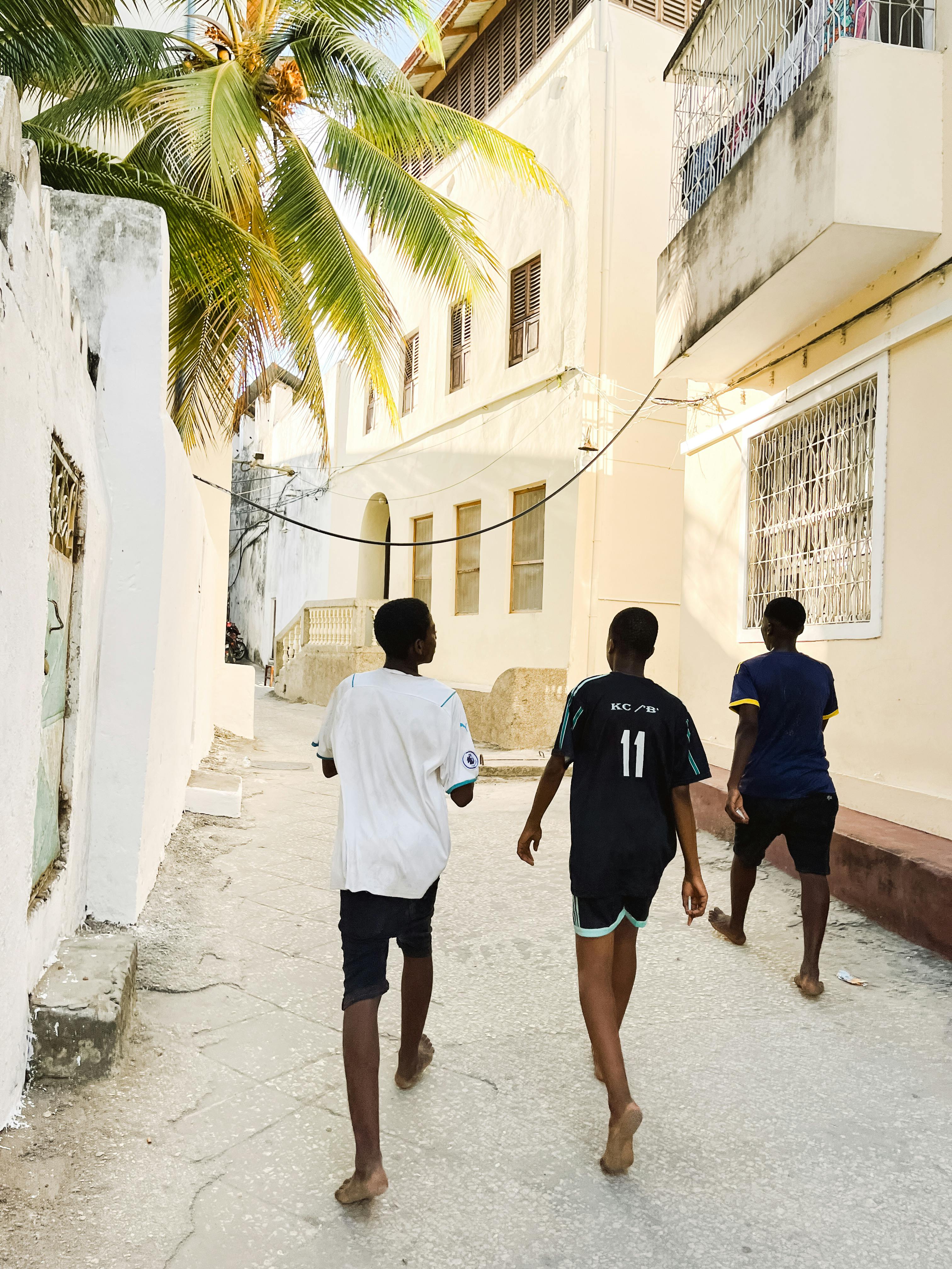 Back View of Teenagers Walking on Street · Free Stock Photo
