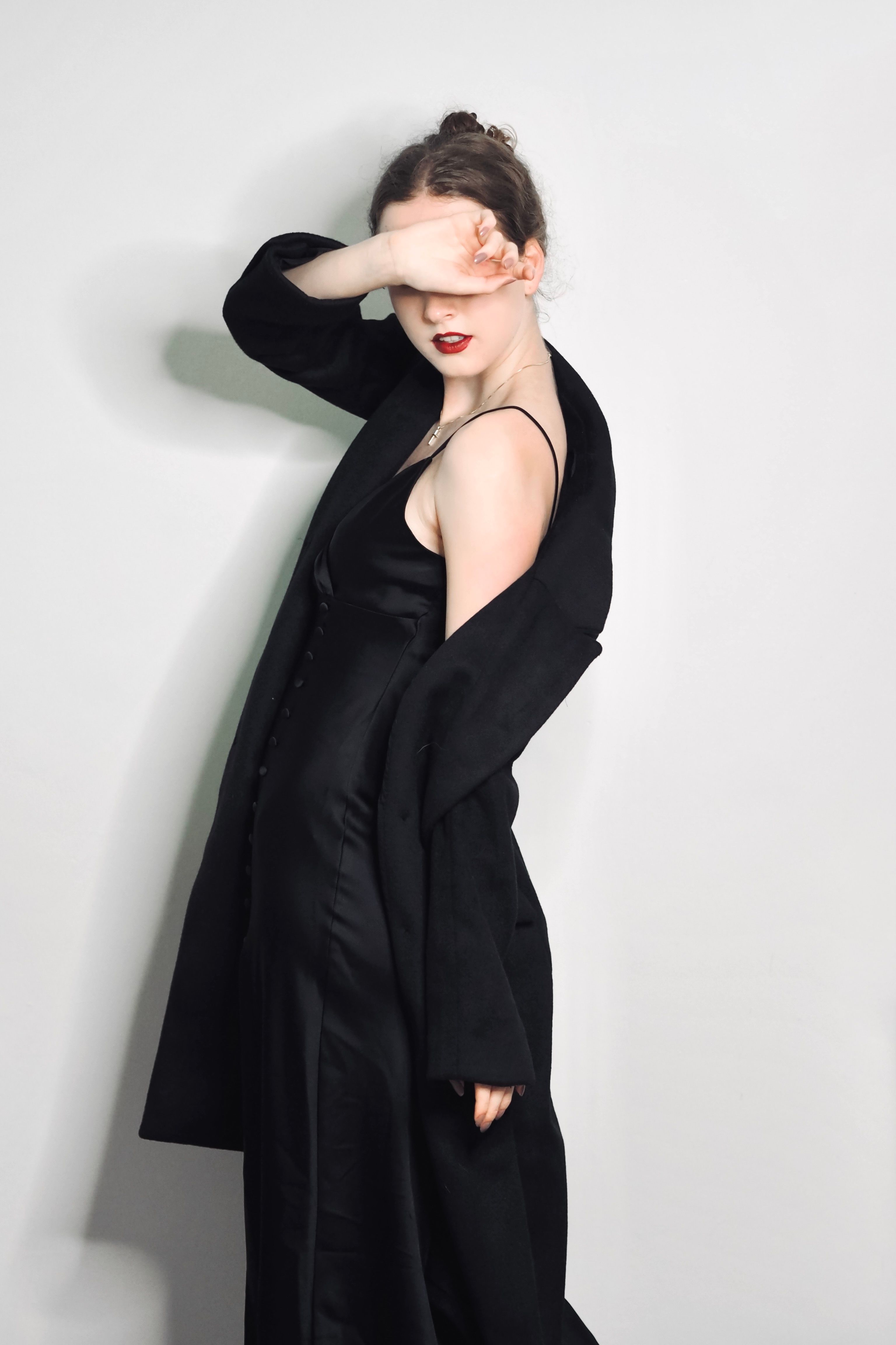Model Posing in a Black Coat · Free Stock Photo