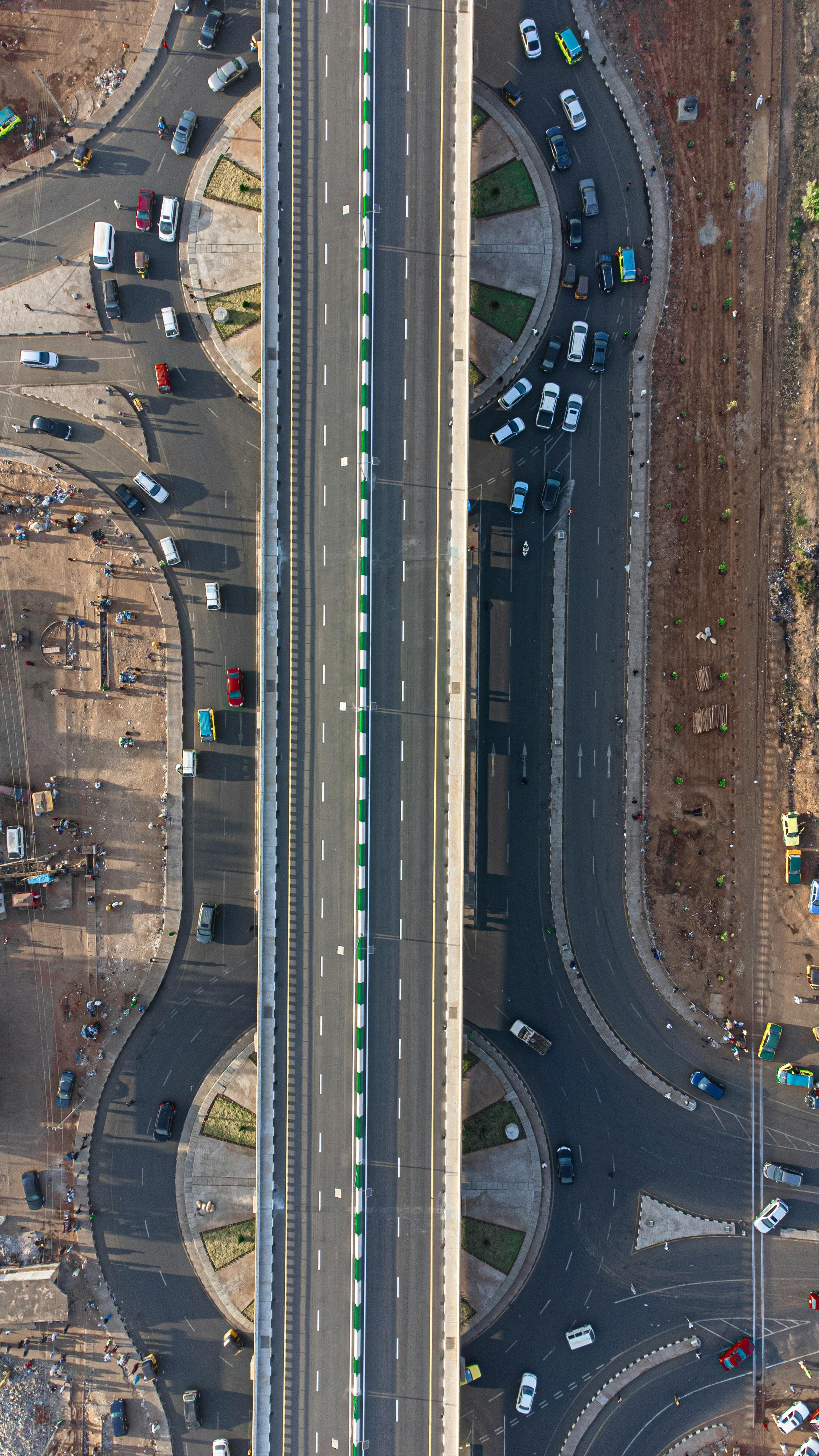 Symmetrical Aerial Footage of a Highway with Roundabouts · Free Stock Photo