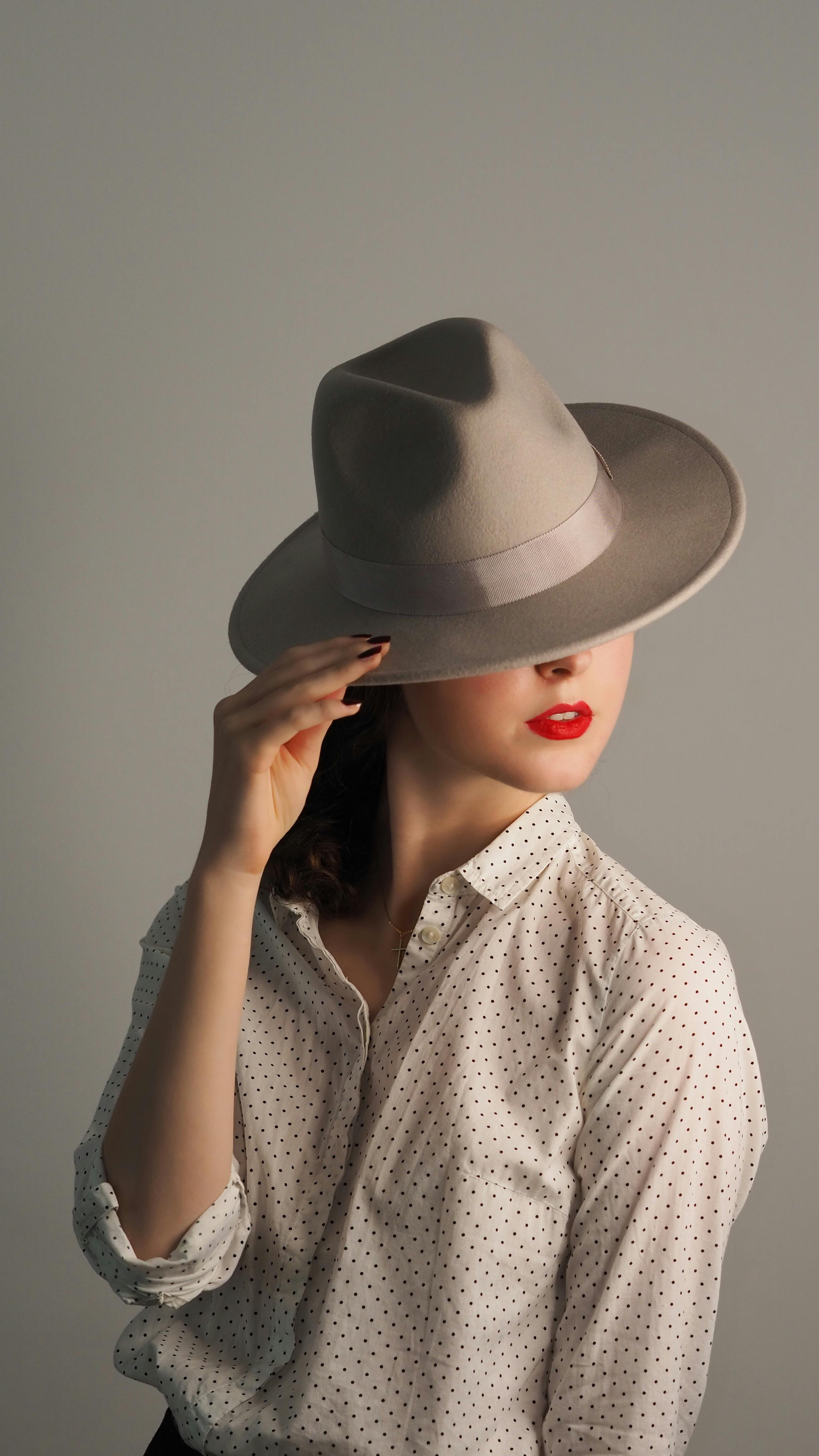 Photo of a Young, Fashionable Woman in a Shirt and a Hat · Free Stock Photo