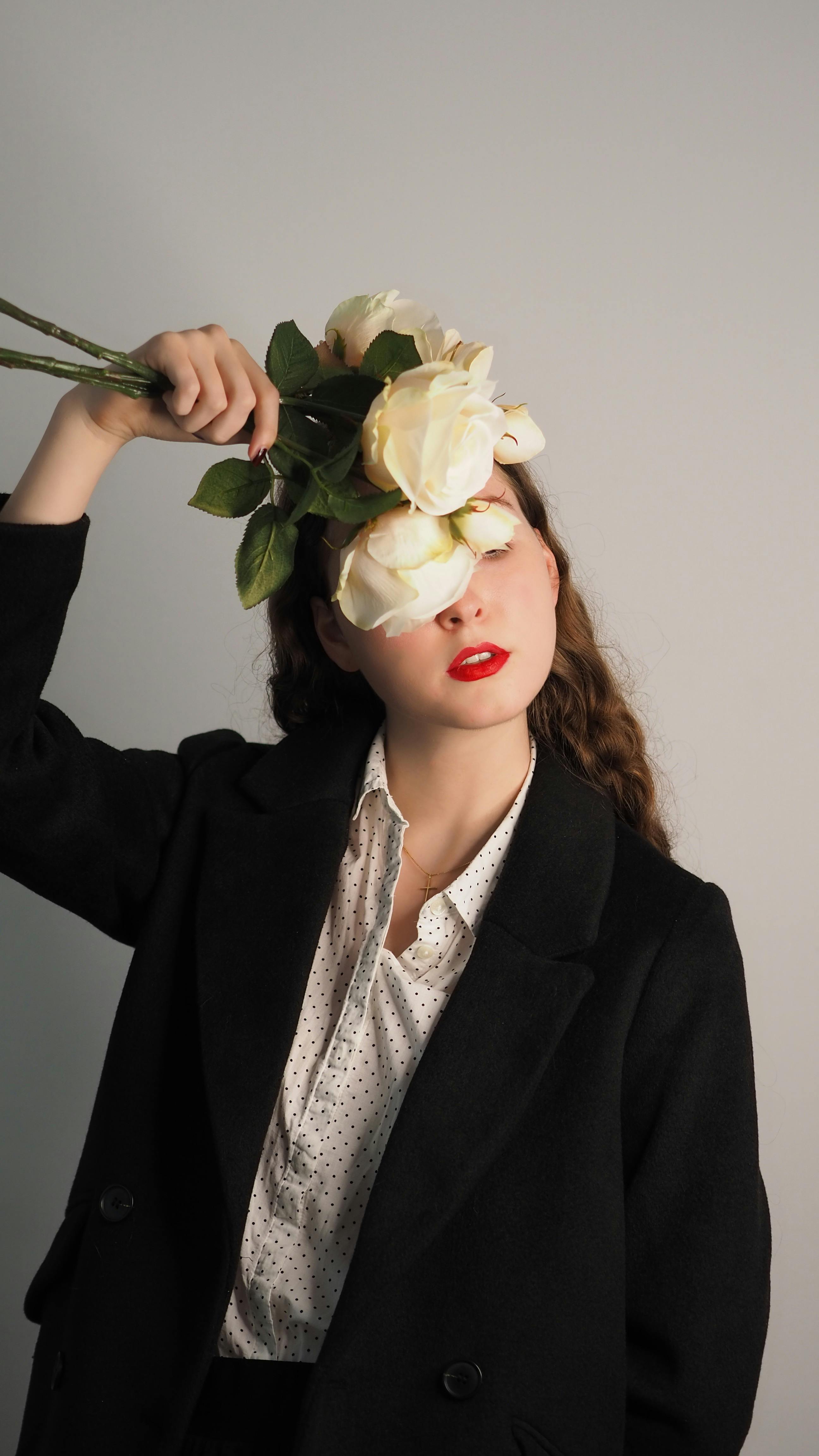 Portrait of Woman Holding Roses · Free Stock Photo