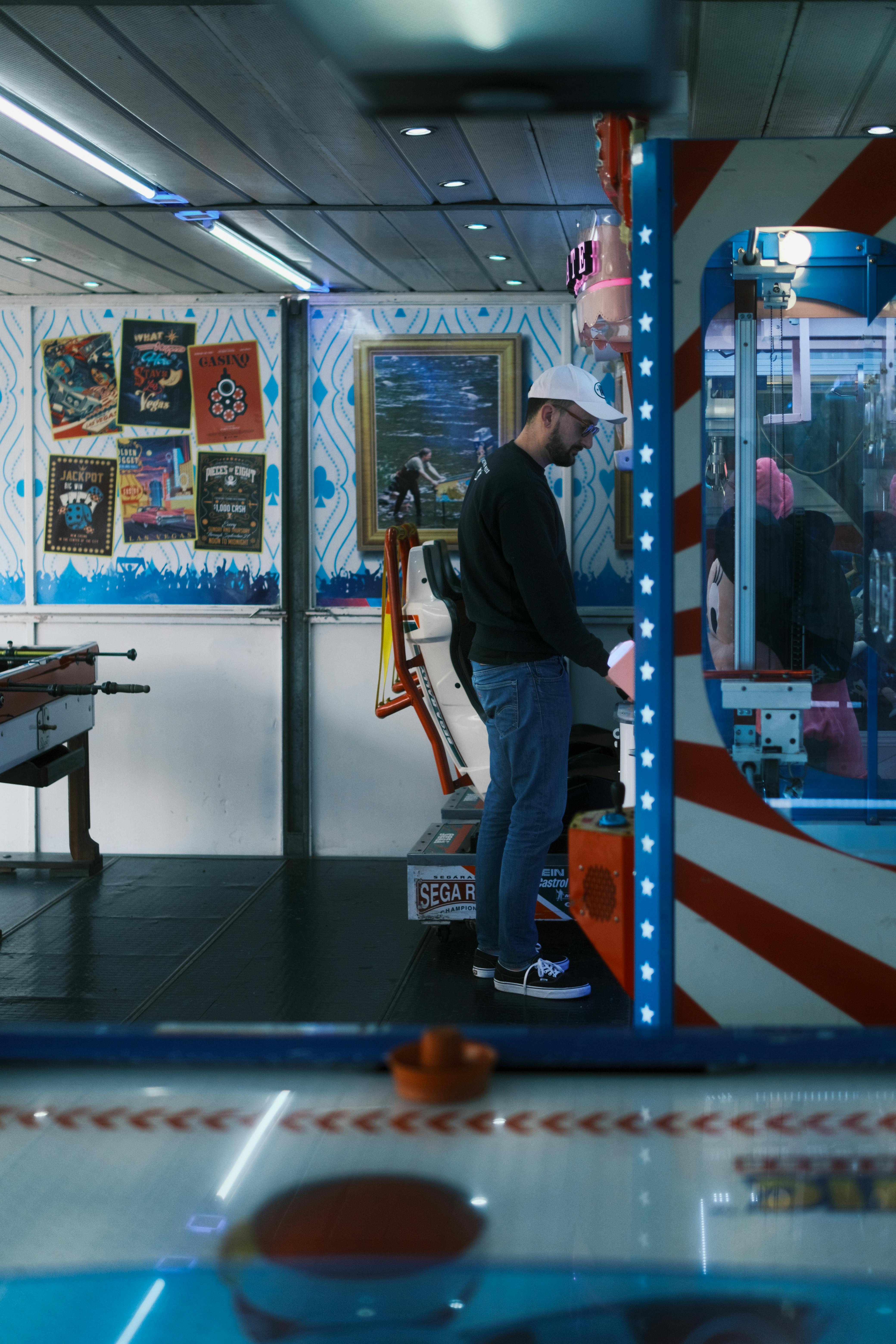 Man Playing Arcade Game · Free Stock Photo