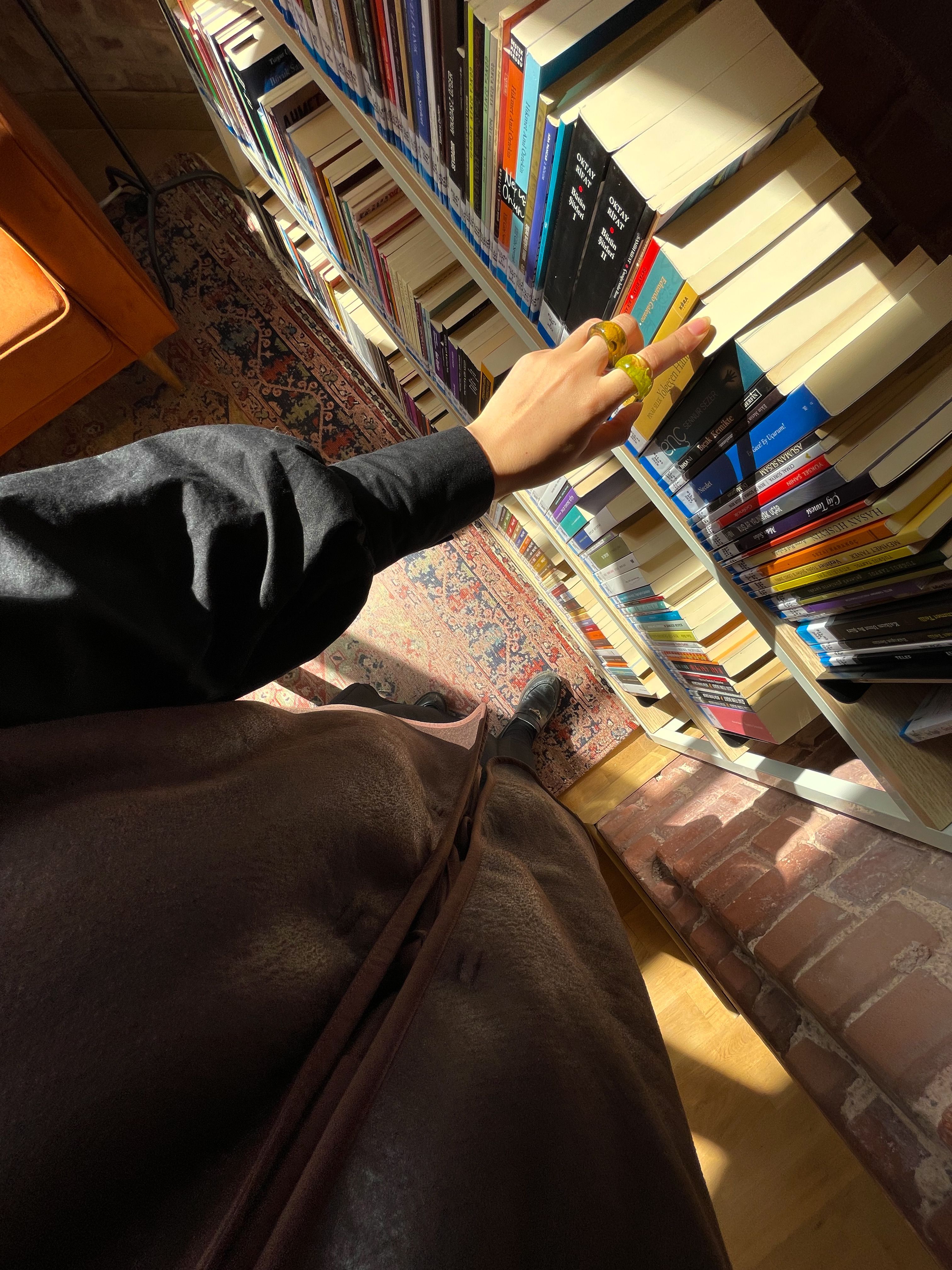 Person Picking Book from Bookcase · Free Stock Photo