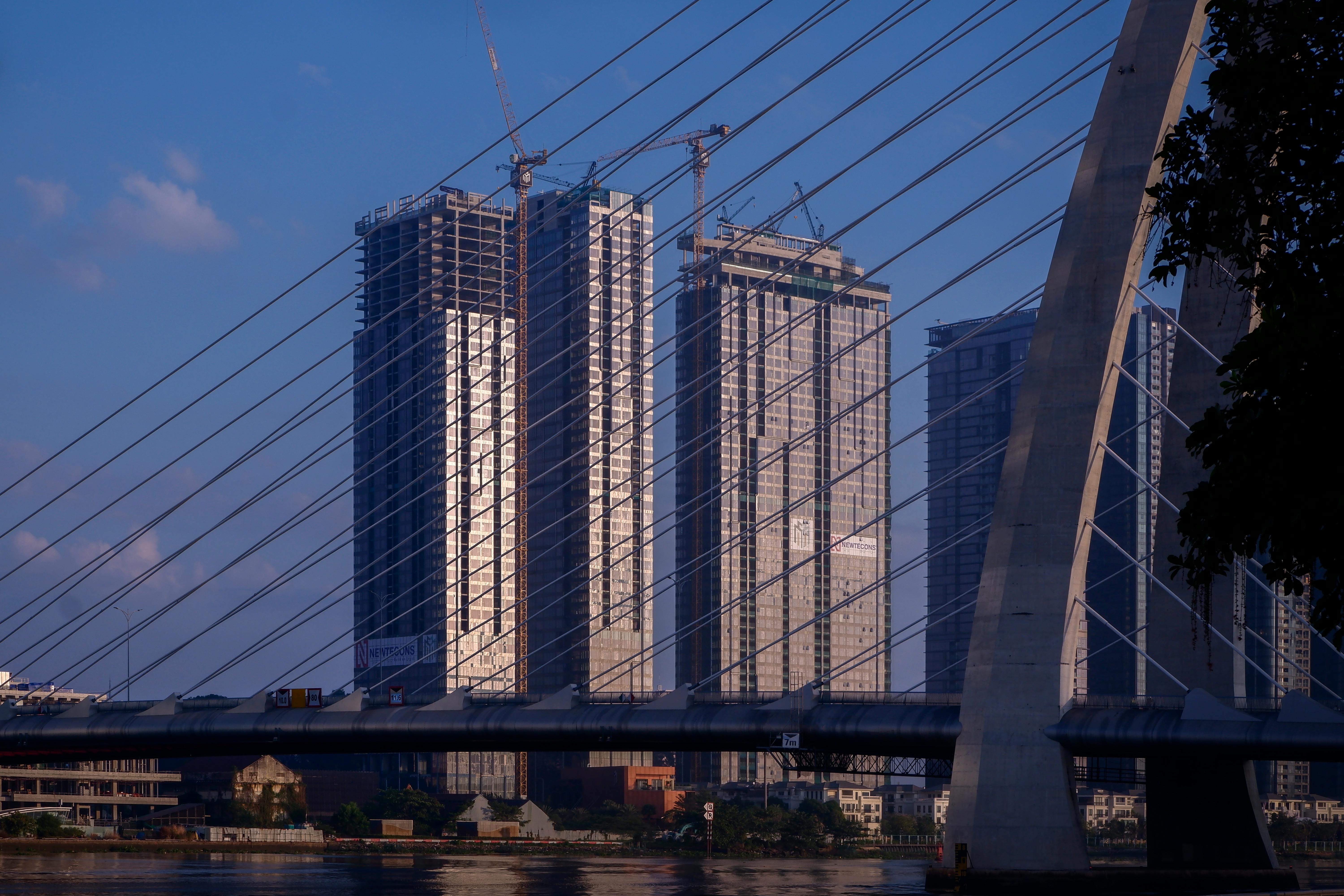 View of a Suspension Bridge and Modern Skyscrapers under Construction ...