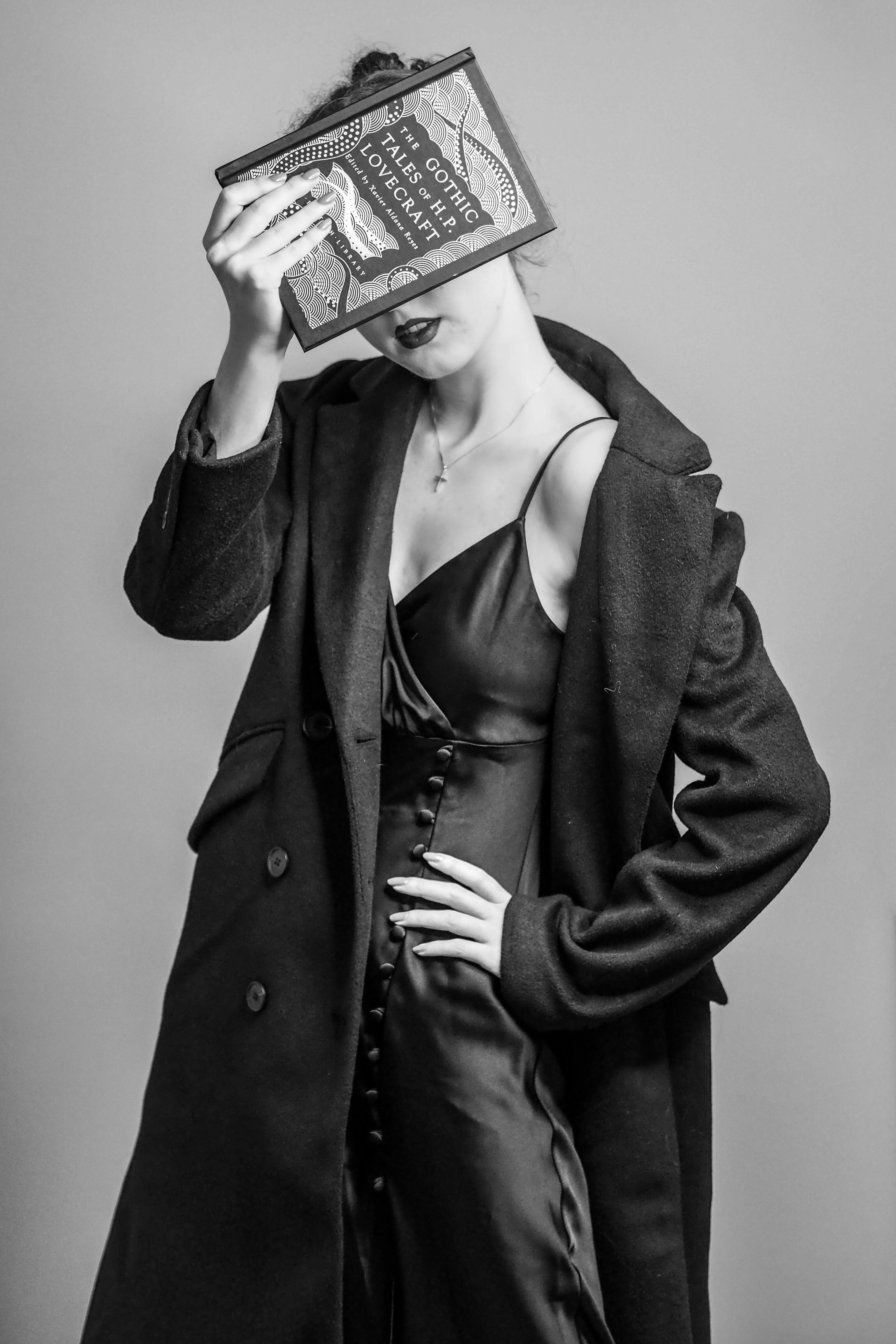 Woman Holding Book in Dress and Coat · Free Stock Photo