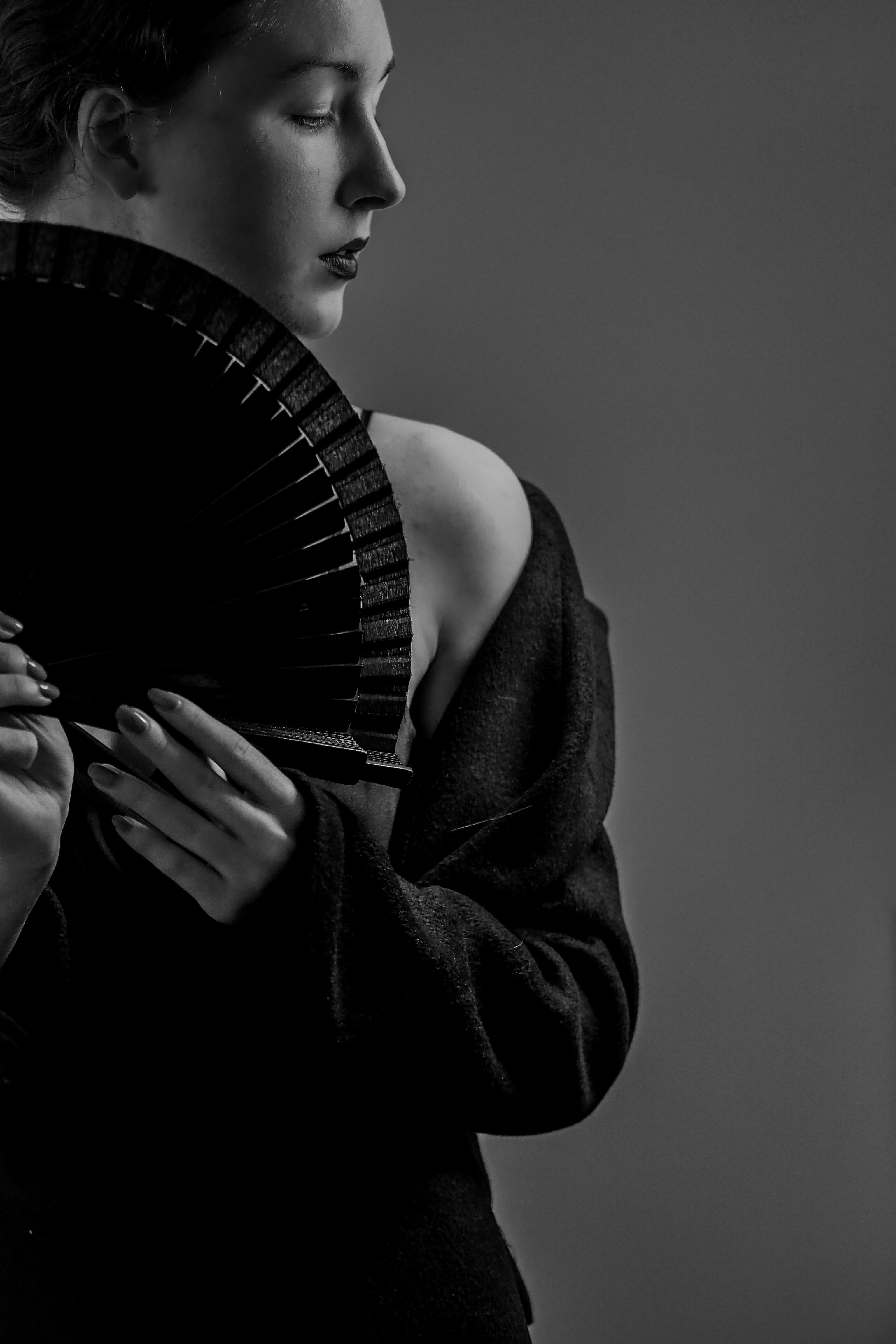 Portrait of Woman Holding Fan · Free Stock Photo