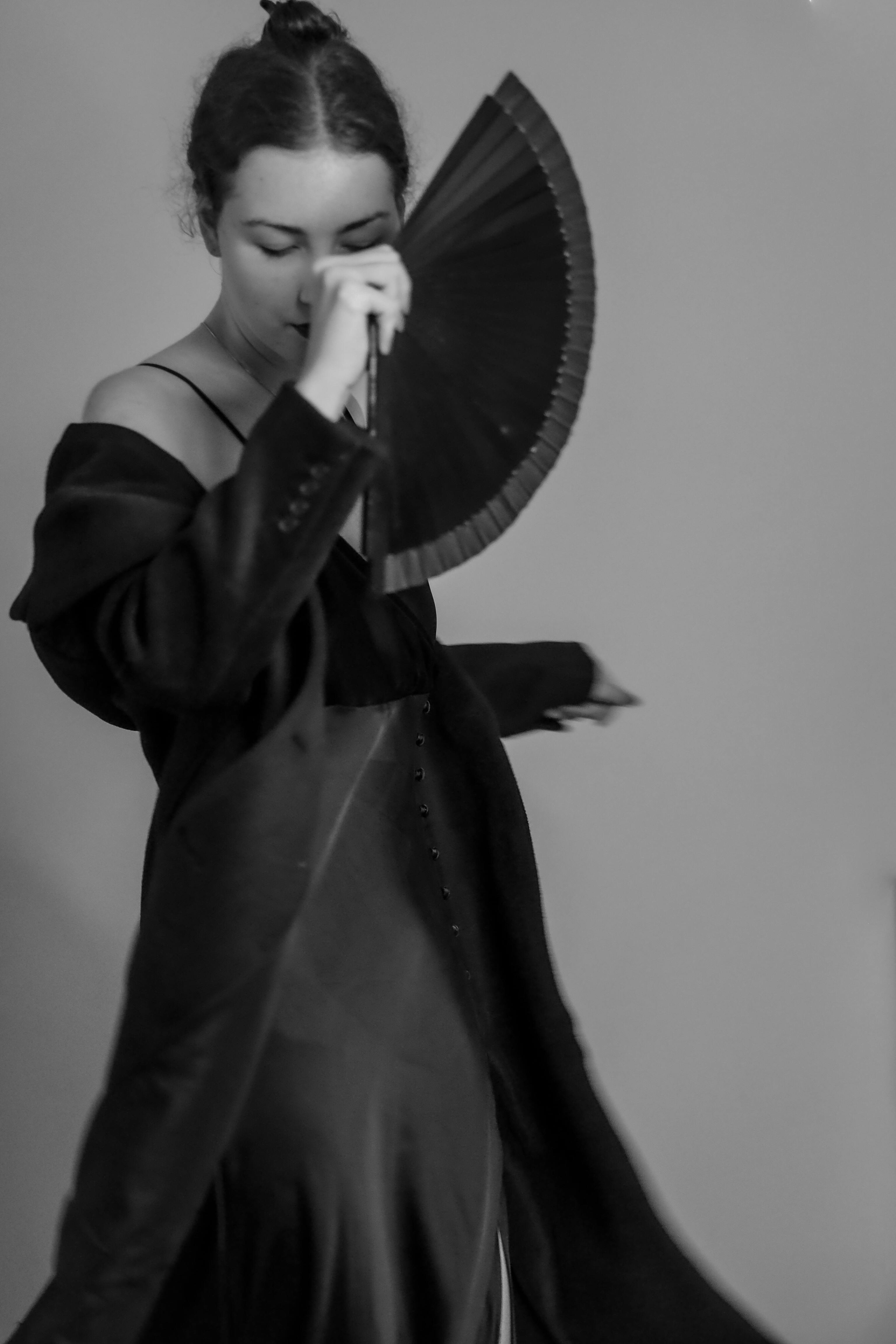 Portrait of Woman Holding Fan · Free Stock Photo