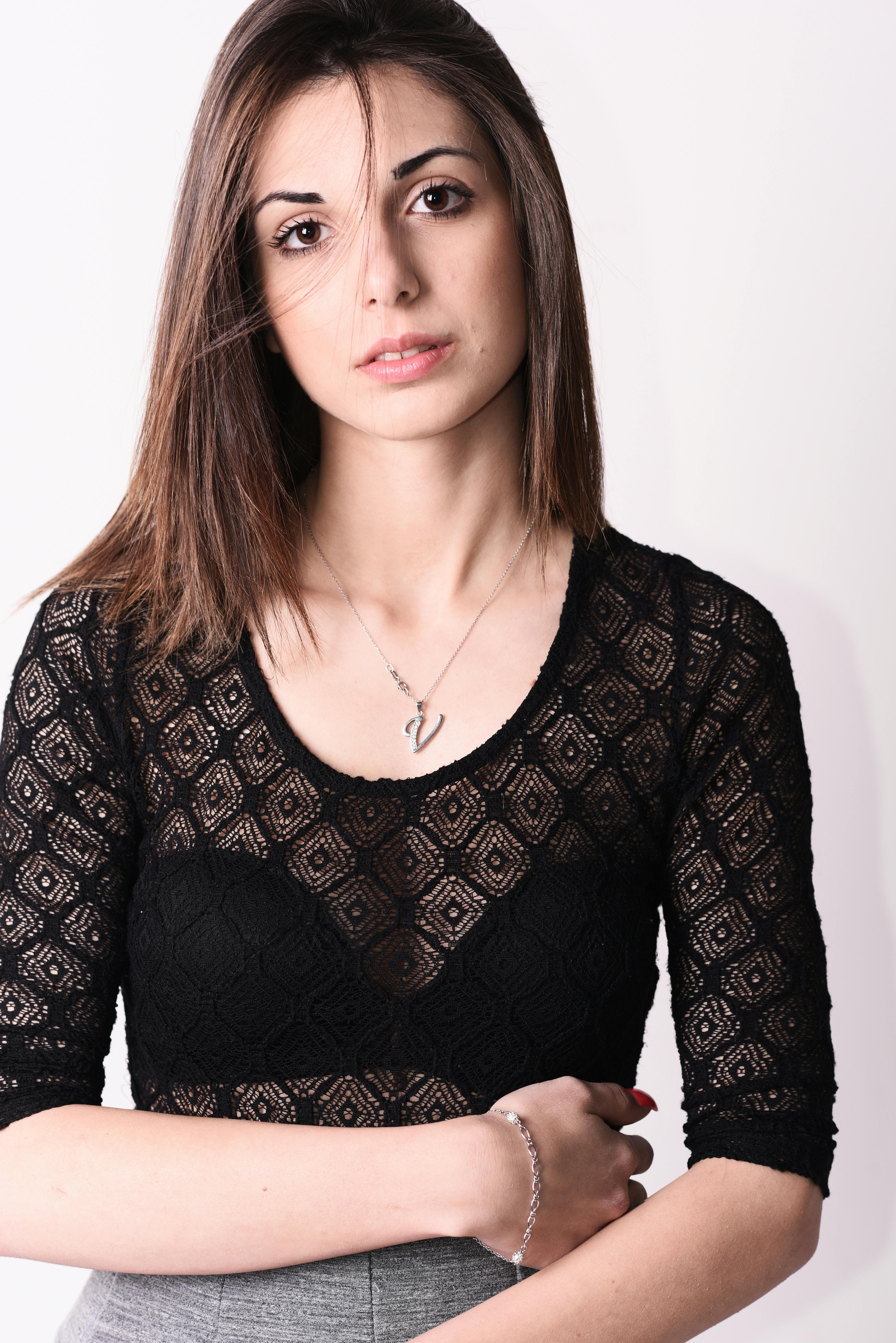 Pretty Brunette Wearing a Black Translucent Top · Free Stock Photo