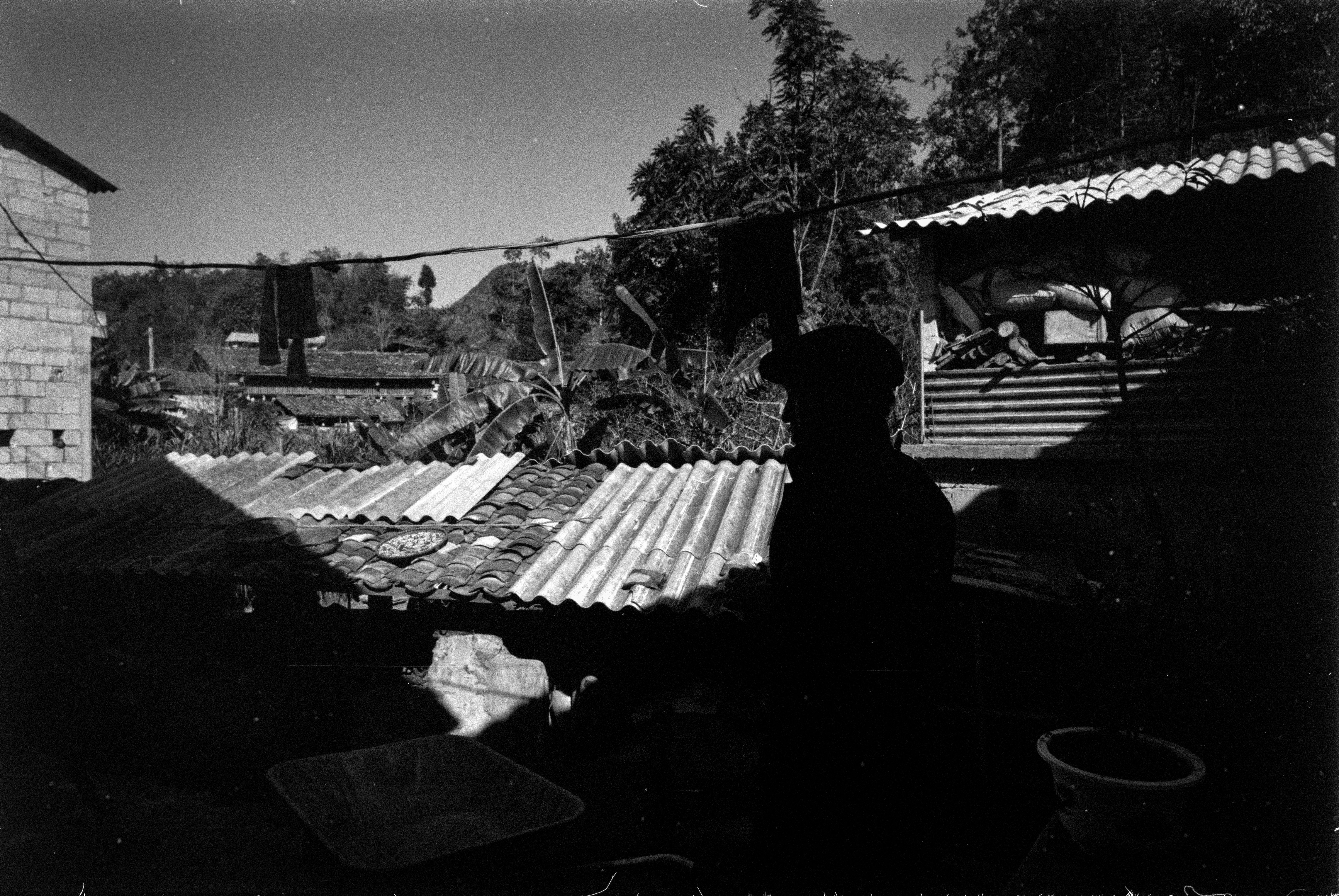 Man in Shadows in Village in Forest · Free Stock Photo