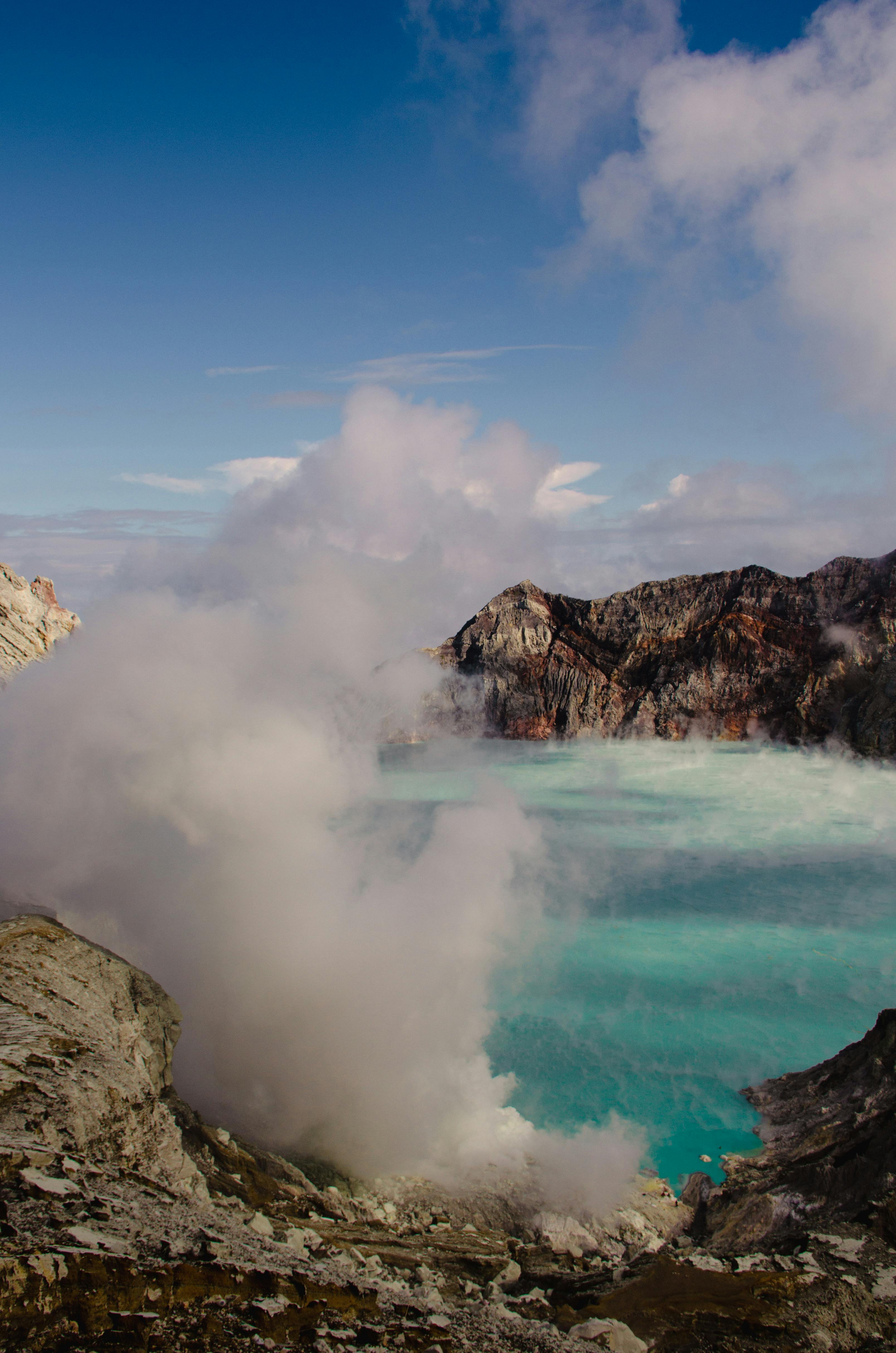 Ijen Volcano with a Lake and Smoke in Indonesia · Free Stock Photo