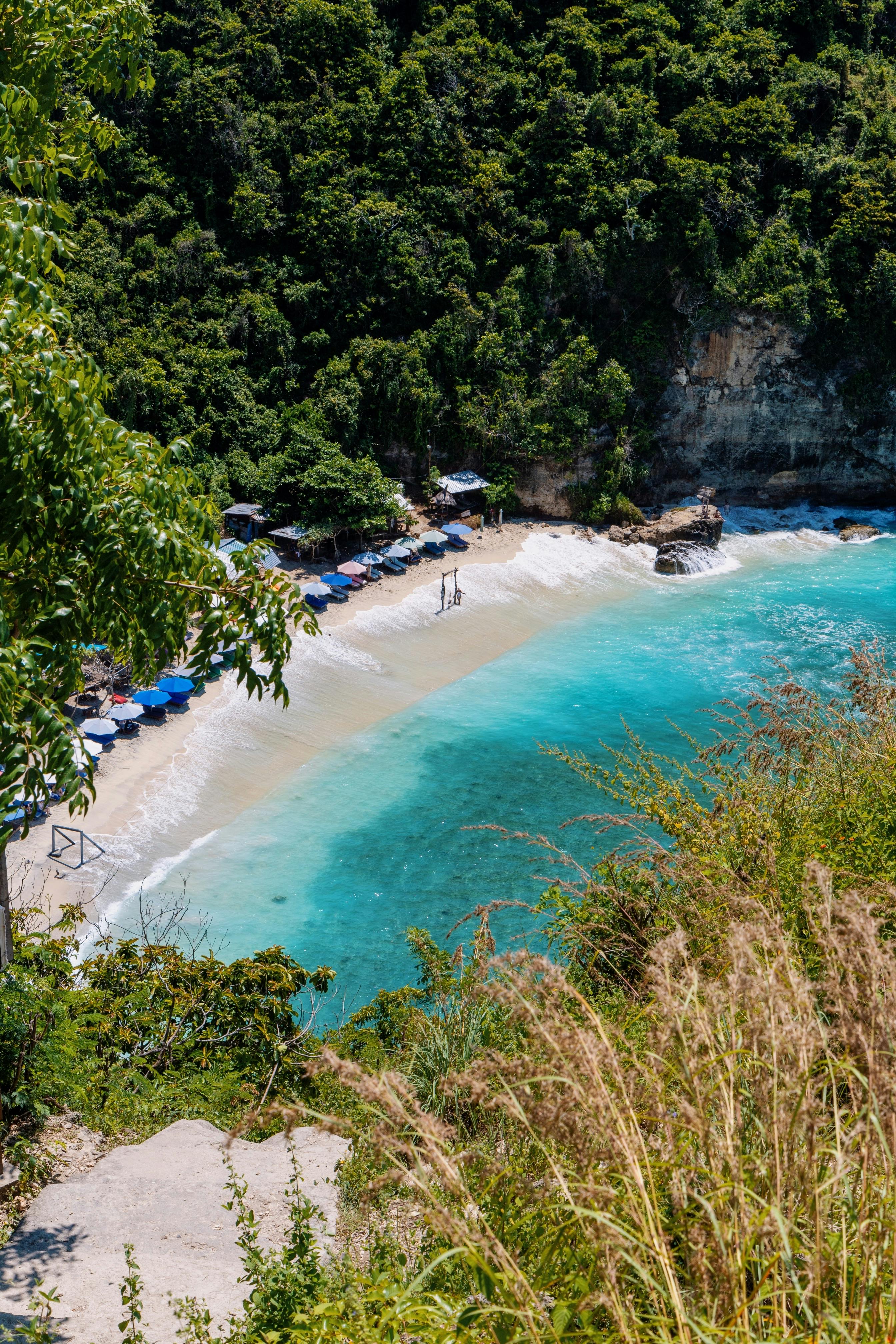 High Angle Photo of Seashore Near Rock Formation · Free Stock Photo