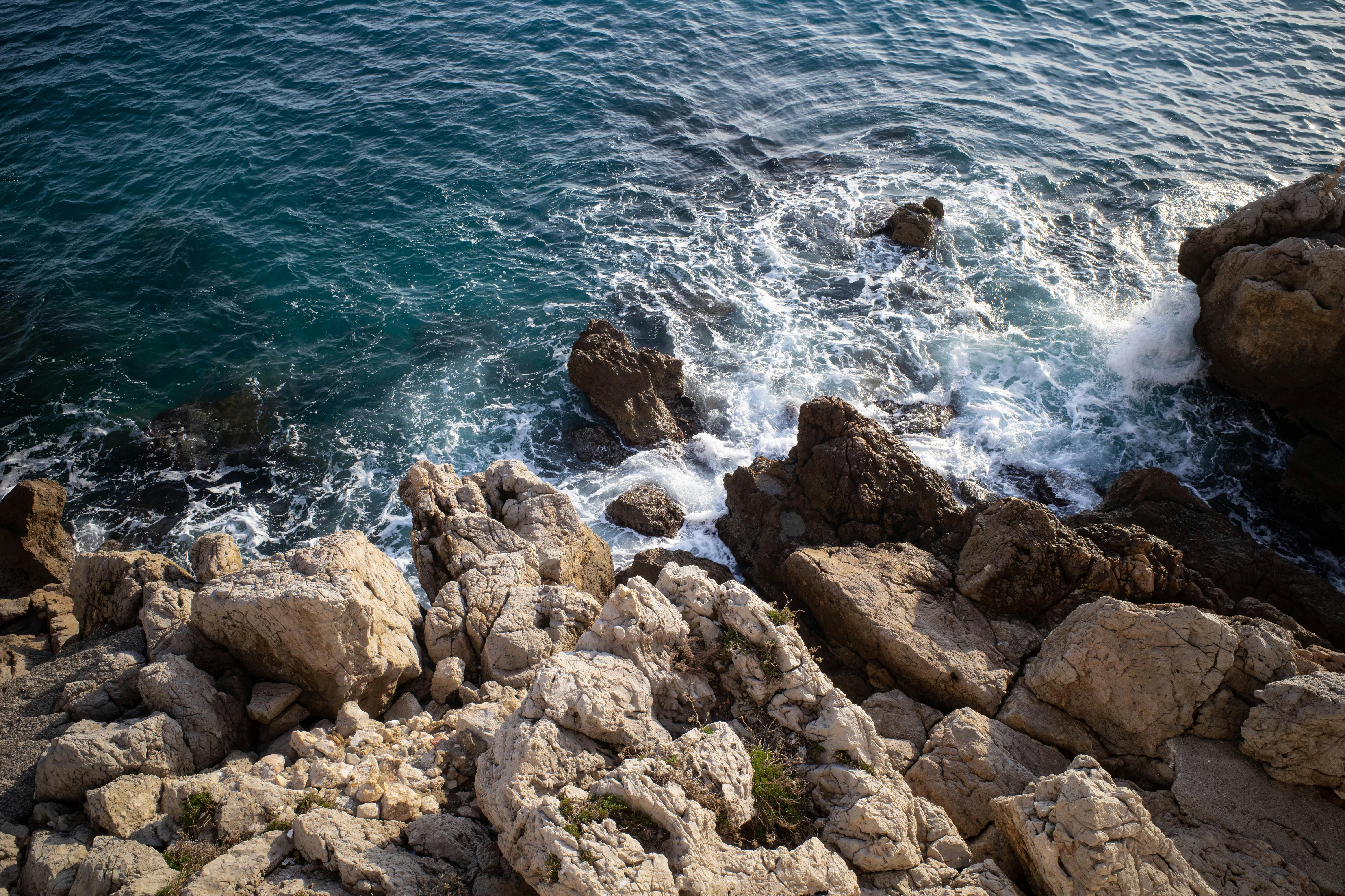 View of Waves Crashing on a Rocky Shore · Free Stock Photo