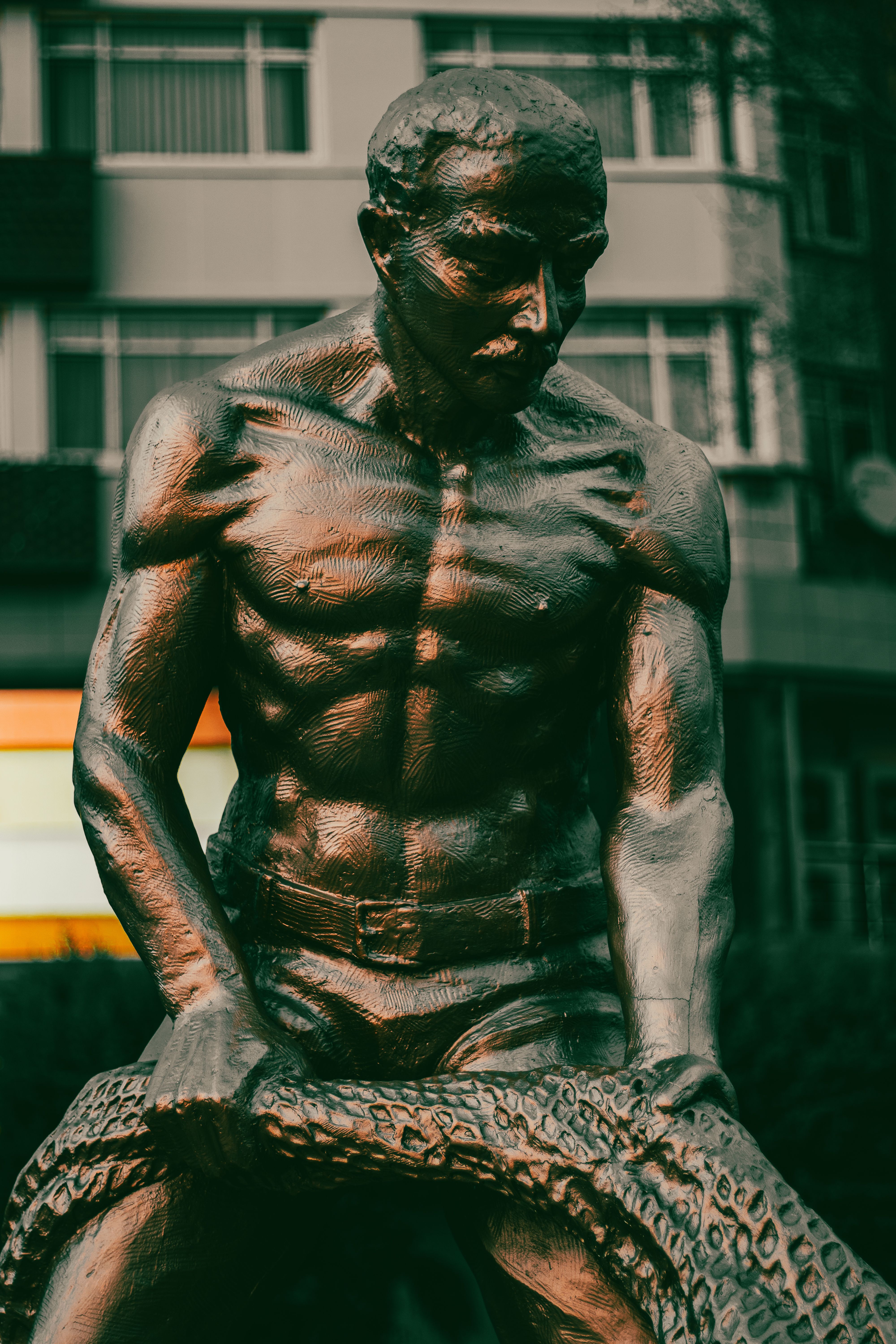 Statue of Muscled Man on a Street · Free Stock Photo