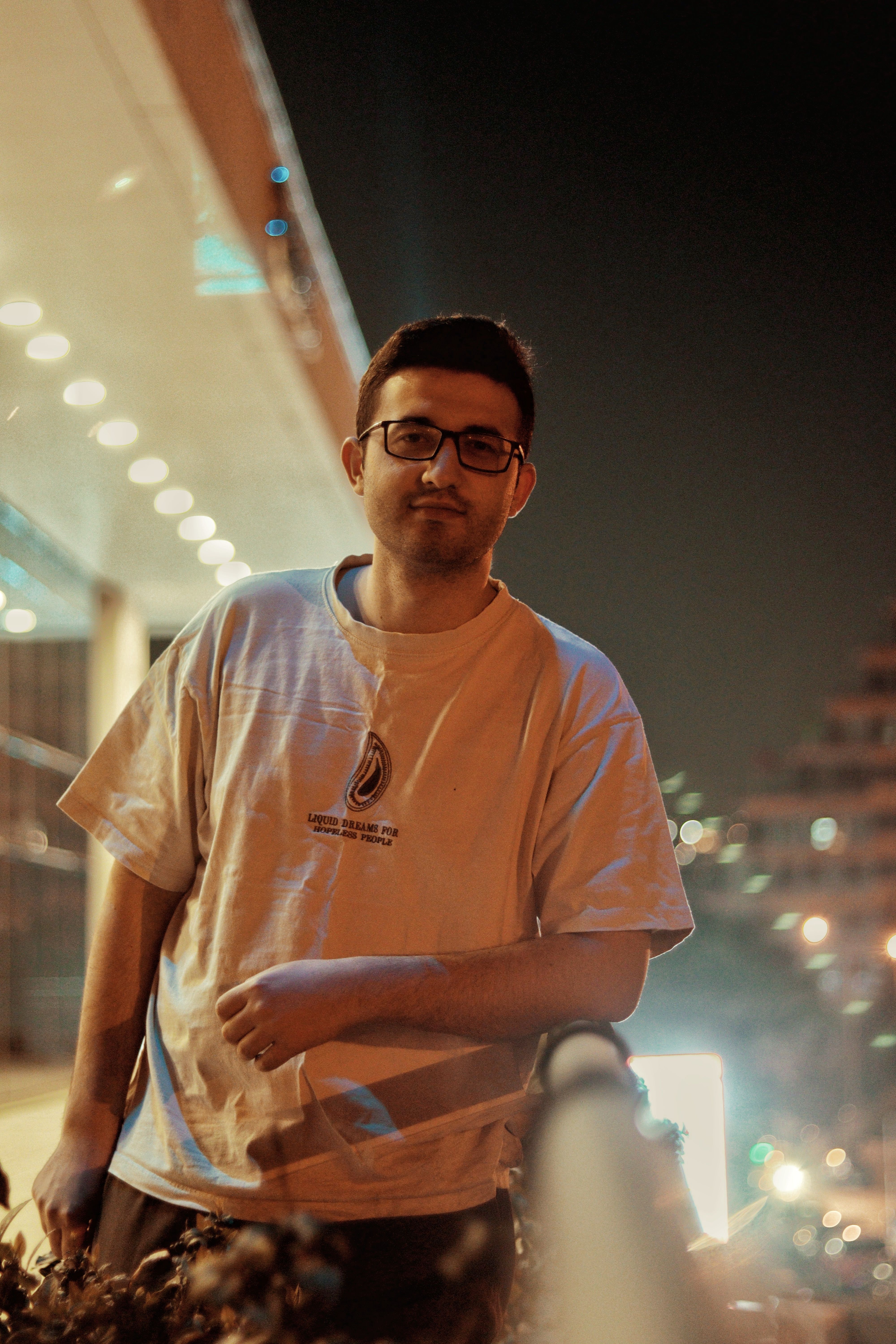 Man on a Balcony at Night · Free Stock Photo