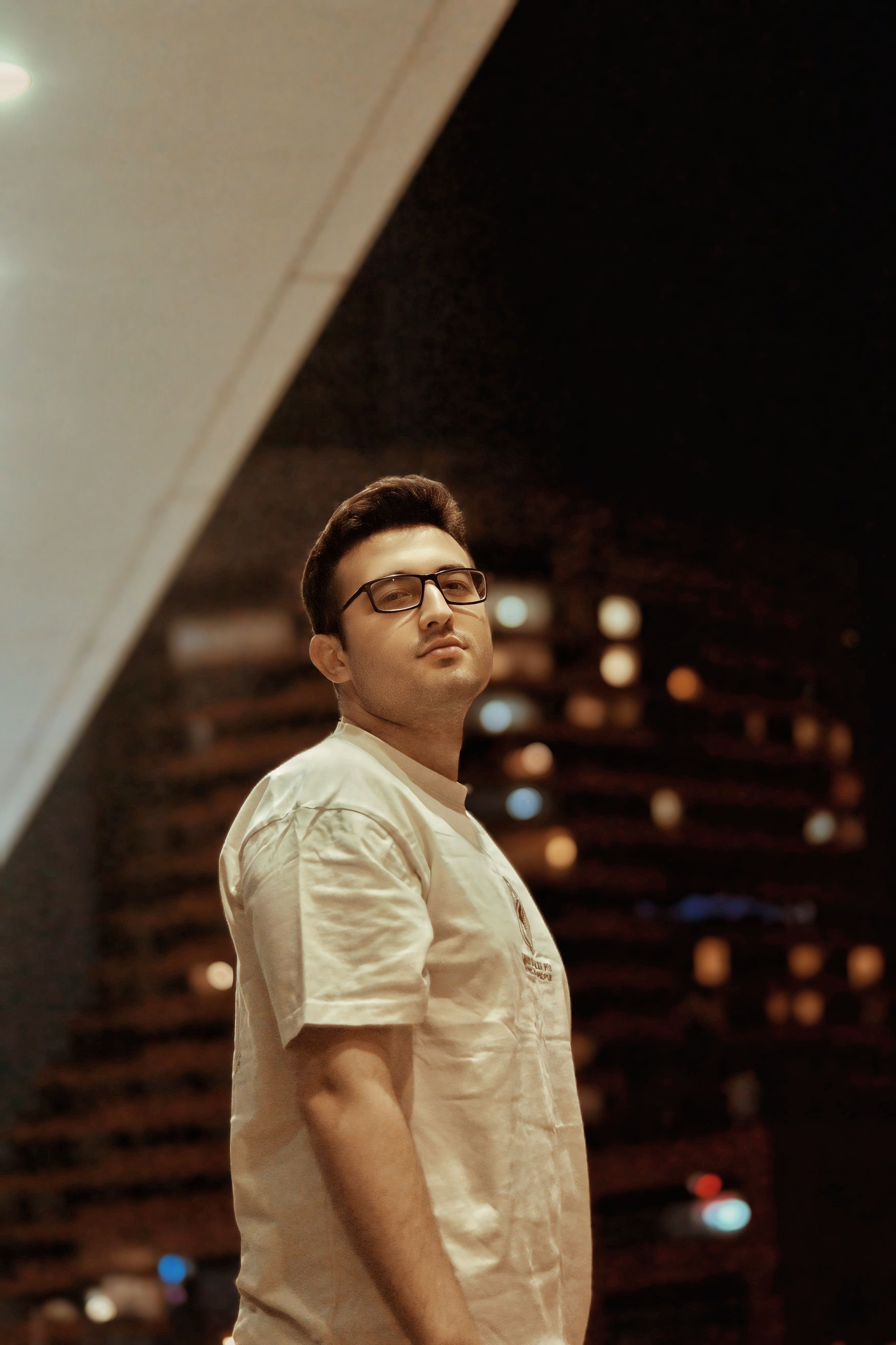 Man on a Balcony at Night · Free Stock Photo