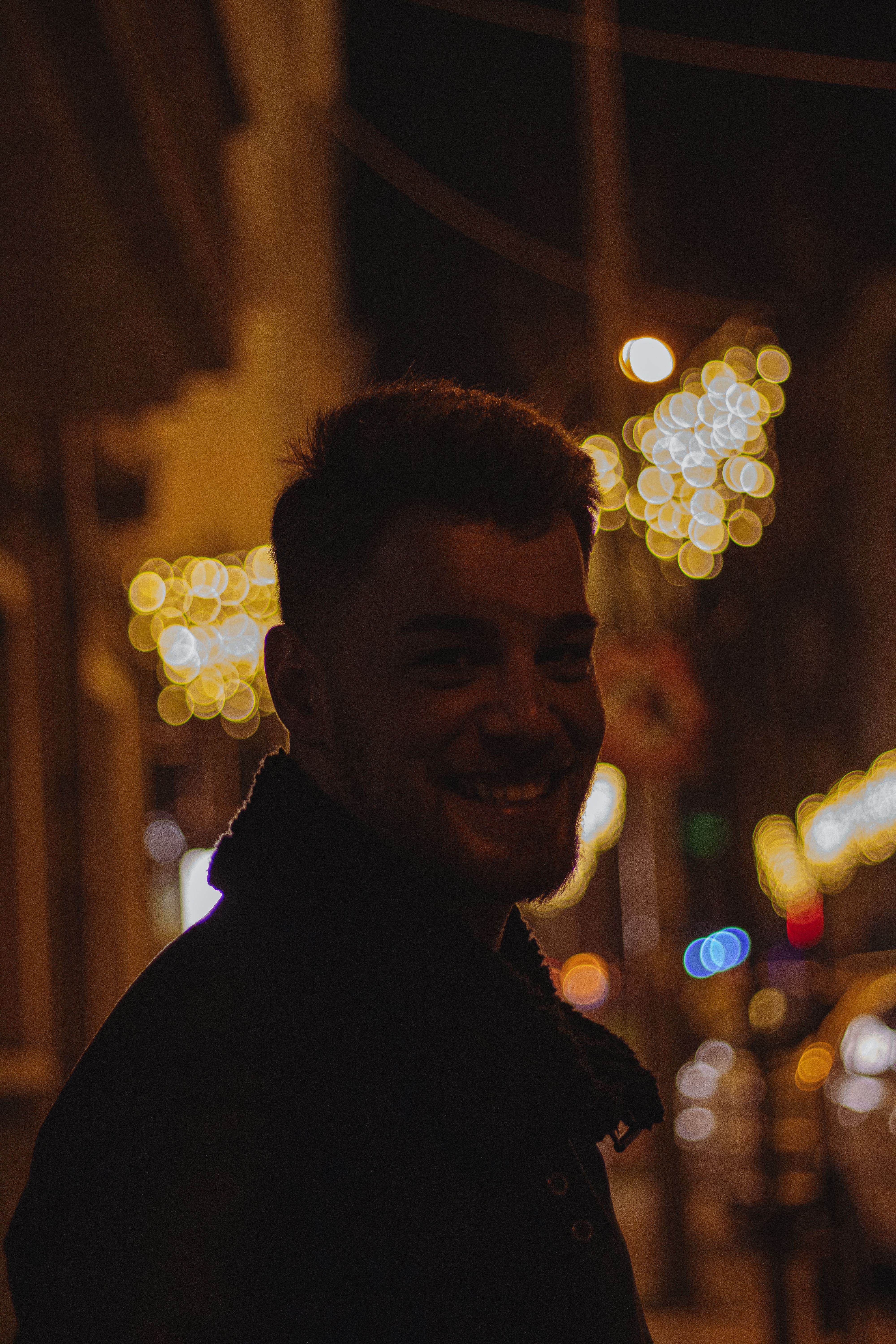 Happy Handsome Man on Street at Night · Free Stock Photo