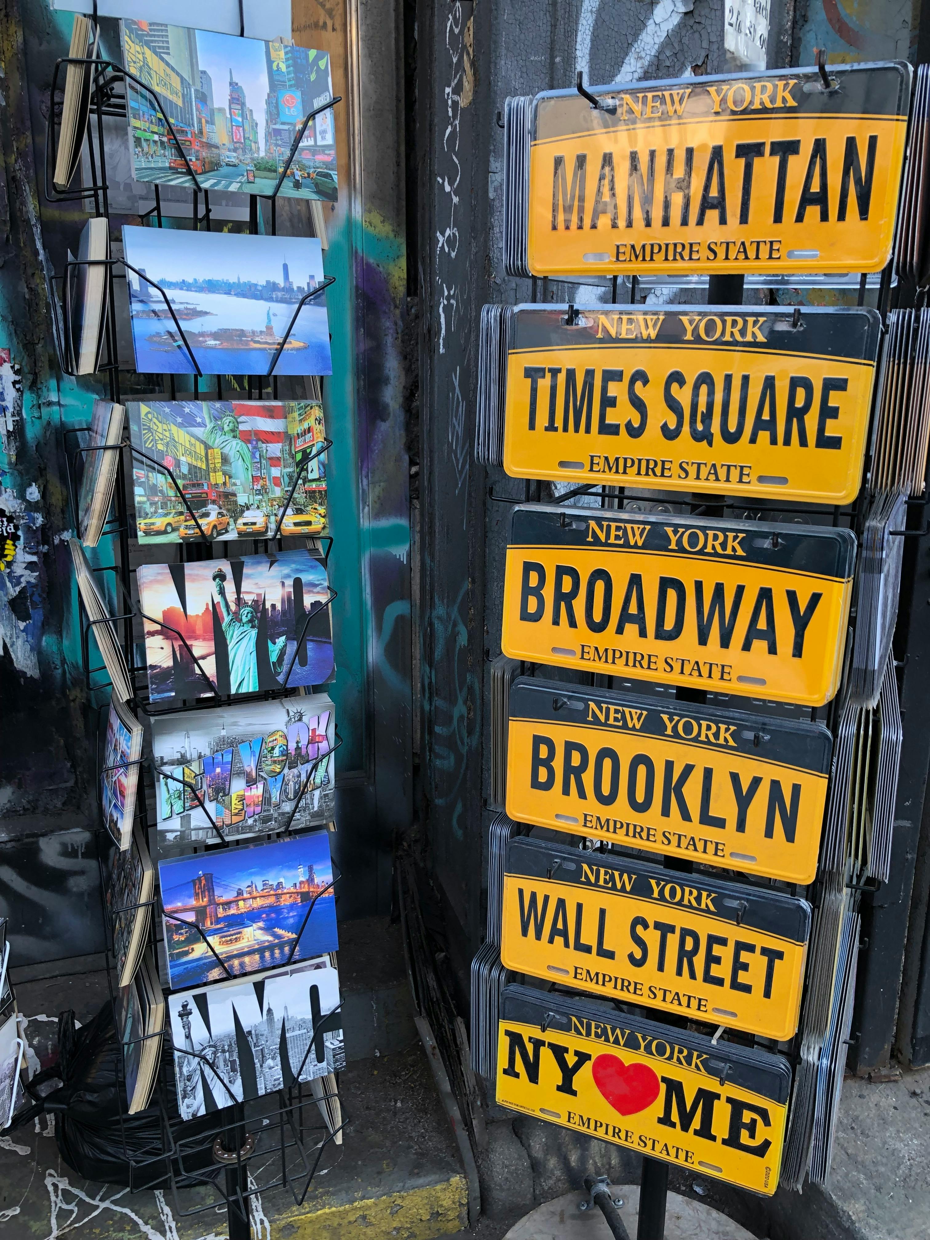 New york city street signs on a street corner · Free Stock Photo
