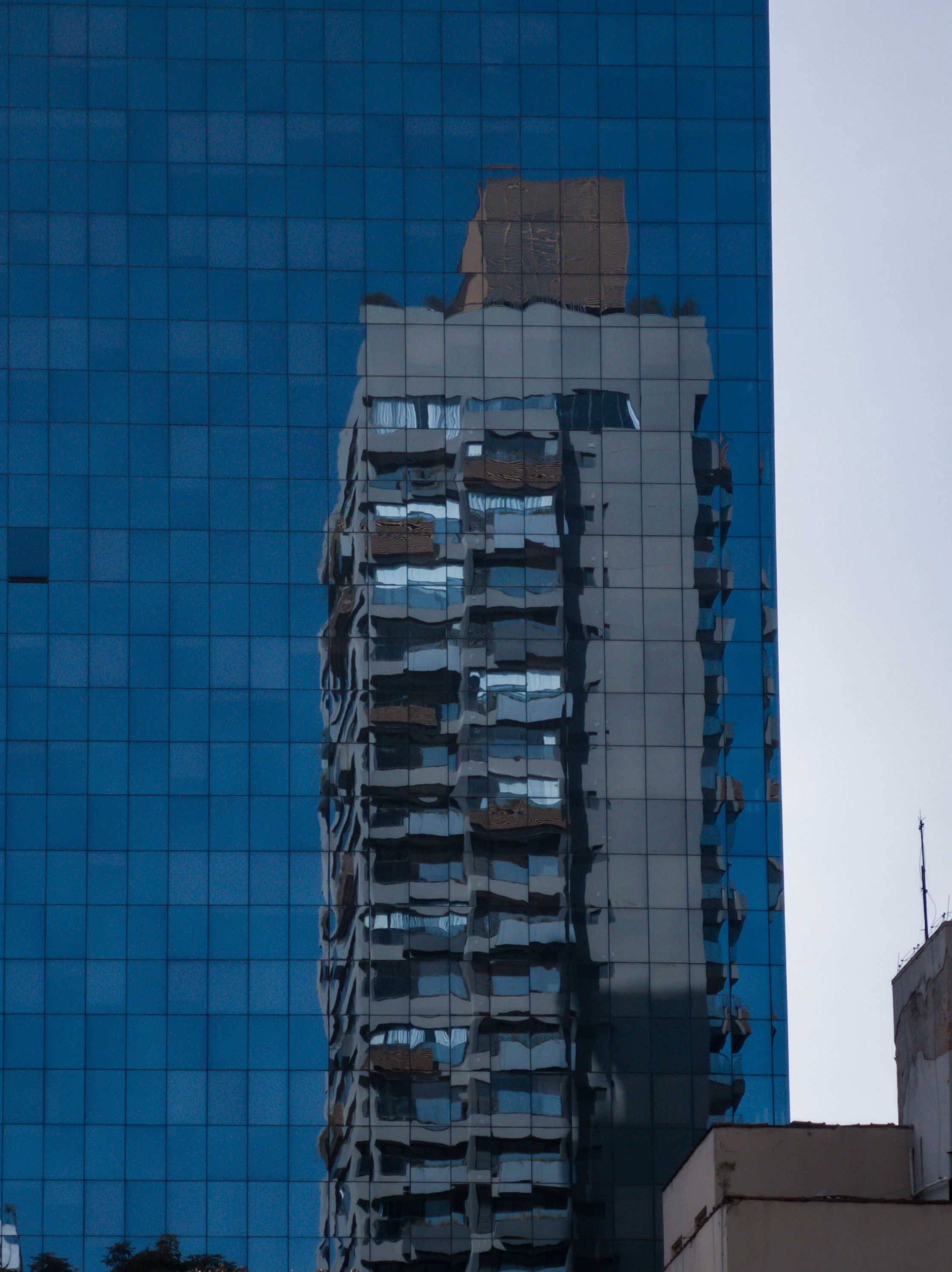 Reflection of Apartment Building in Windows of Skyscraper · Free Stock ...