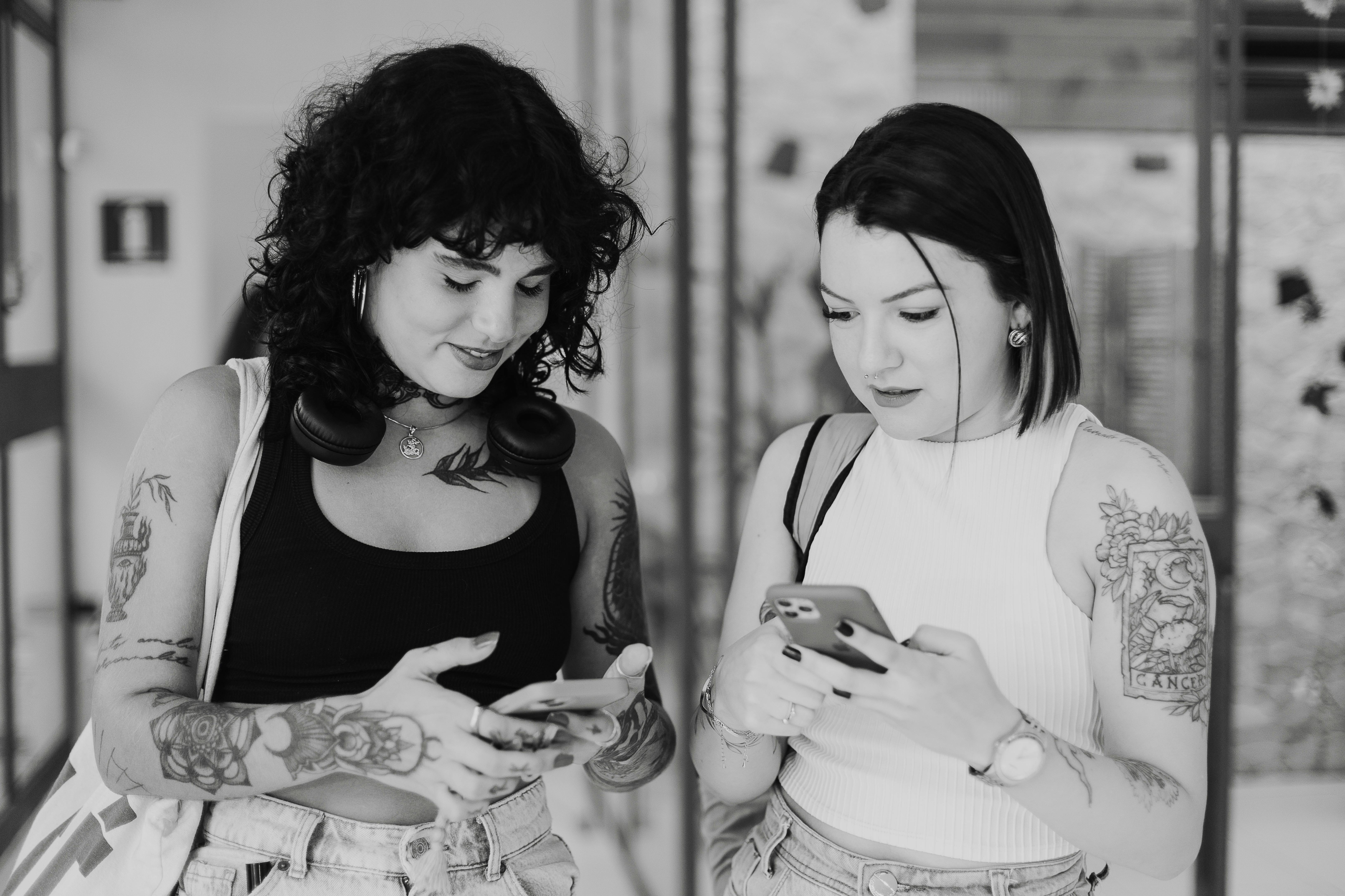 Woman Tapping on Smartphones · Free Stock Photo