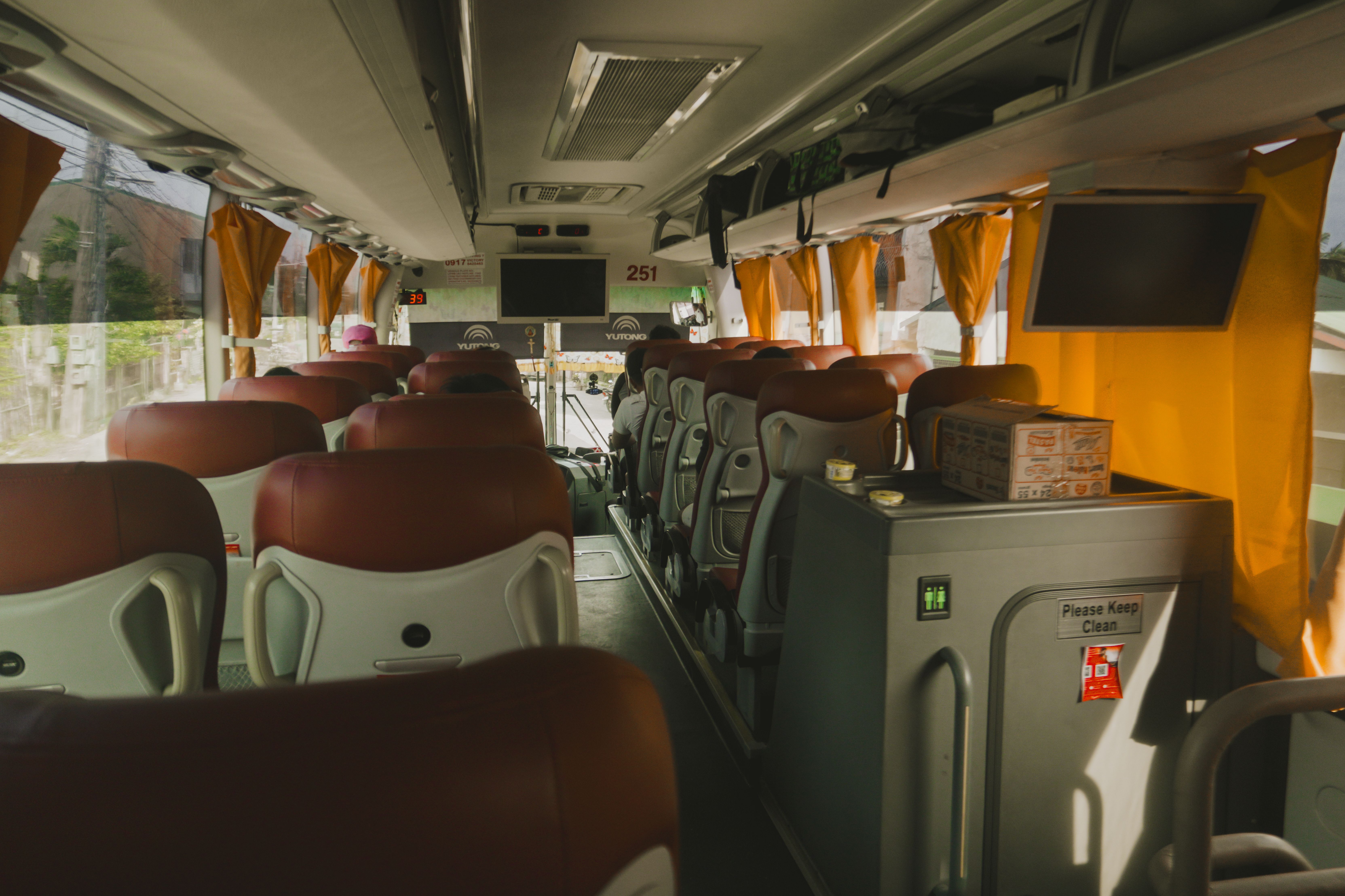 A bus with seats and a television screen · Free Stock Photo