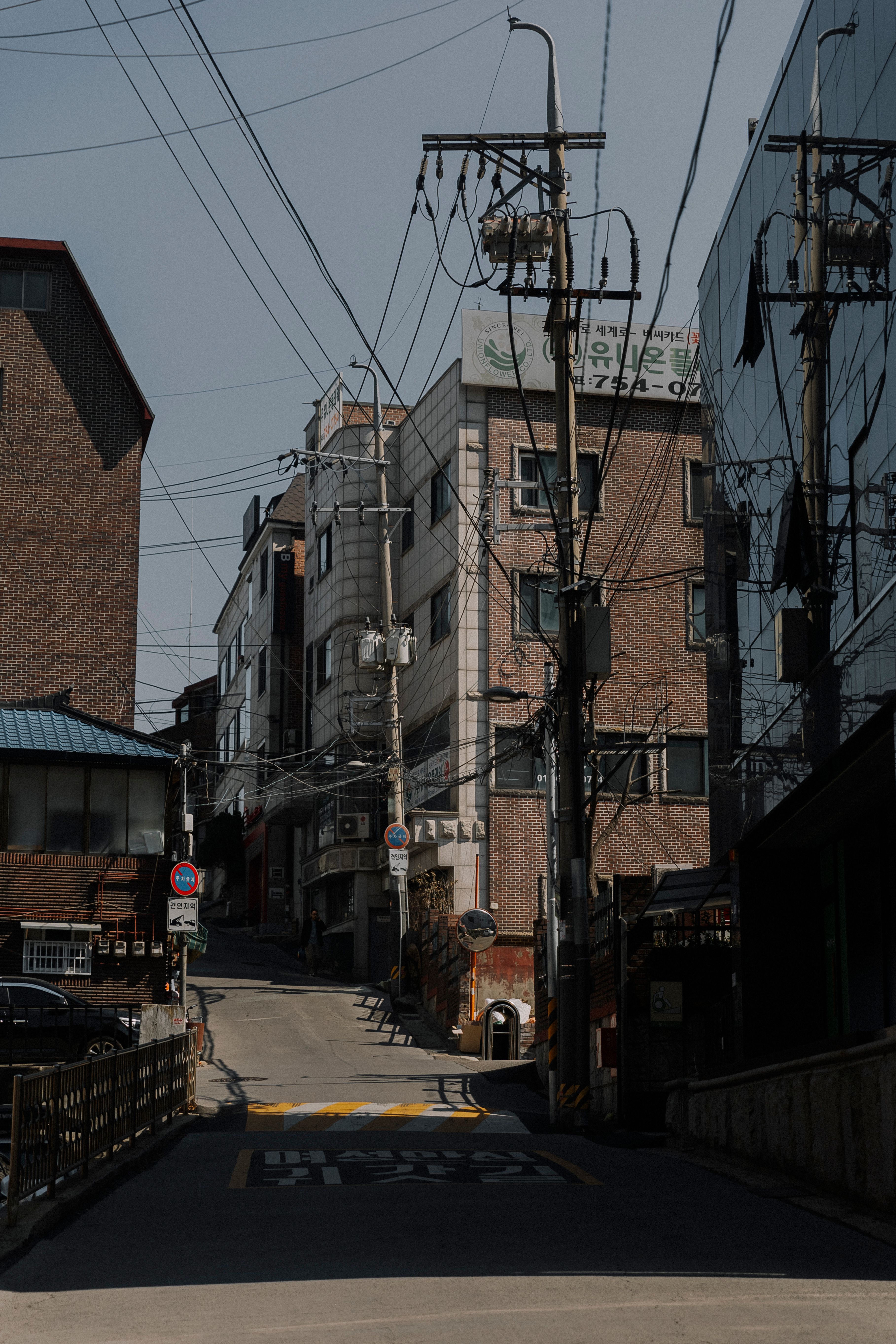 Power Lines and Utility Pole over Street in Town · Free Stock Photo