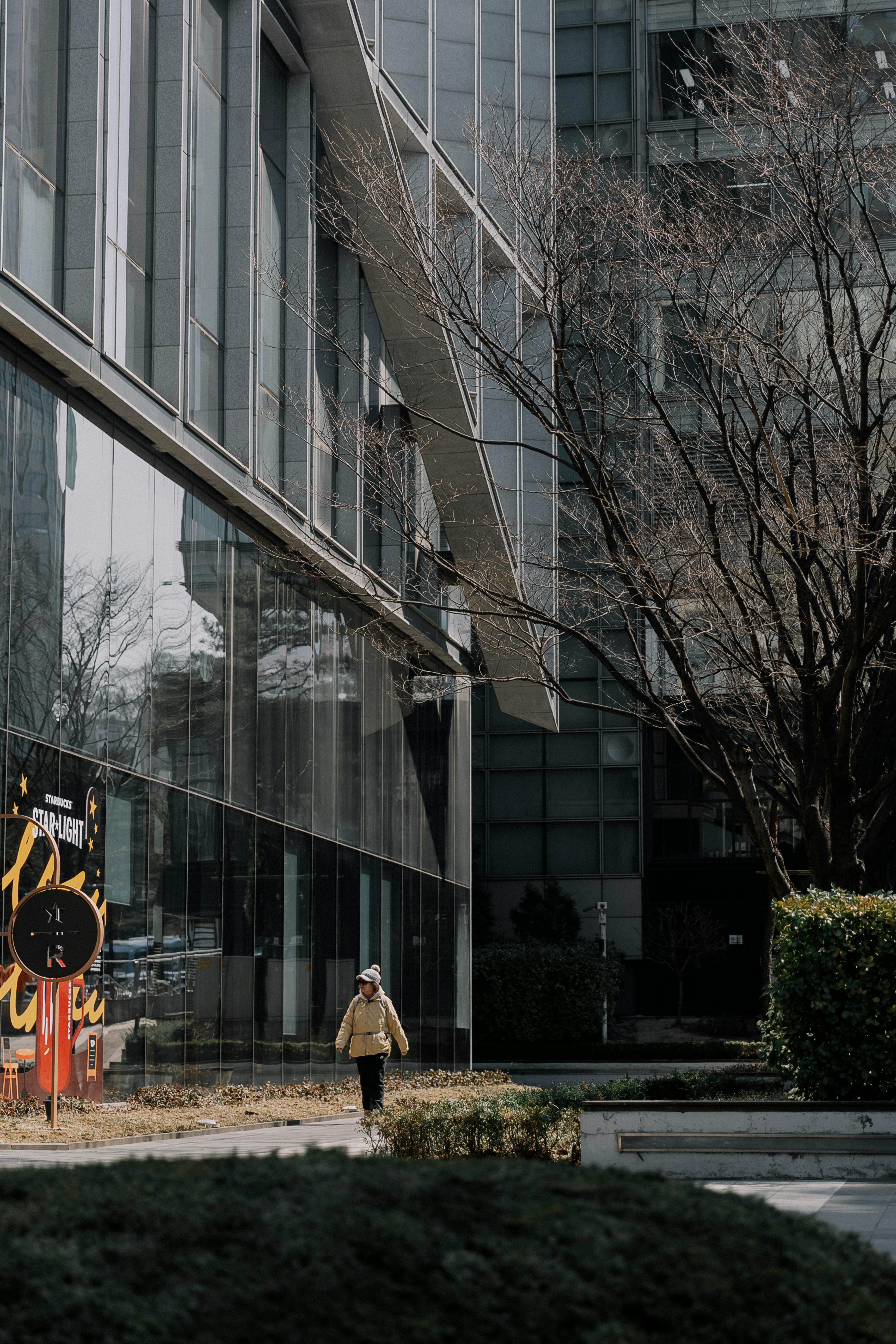 Person Walking near Building · Free Stock Photo