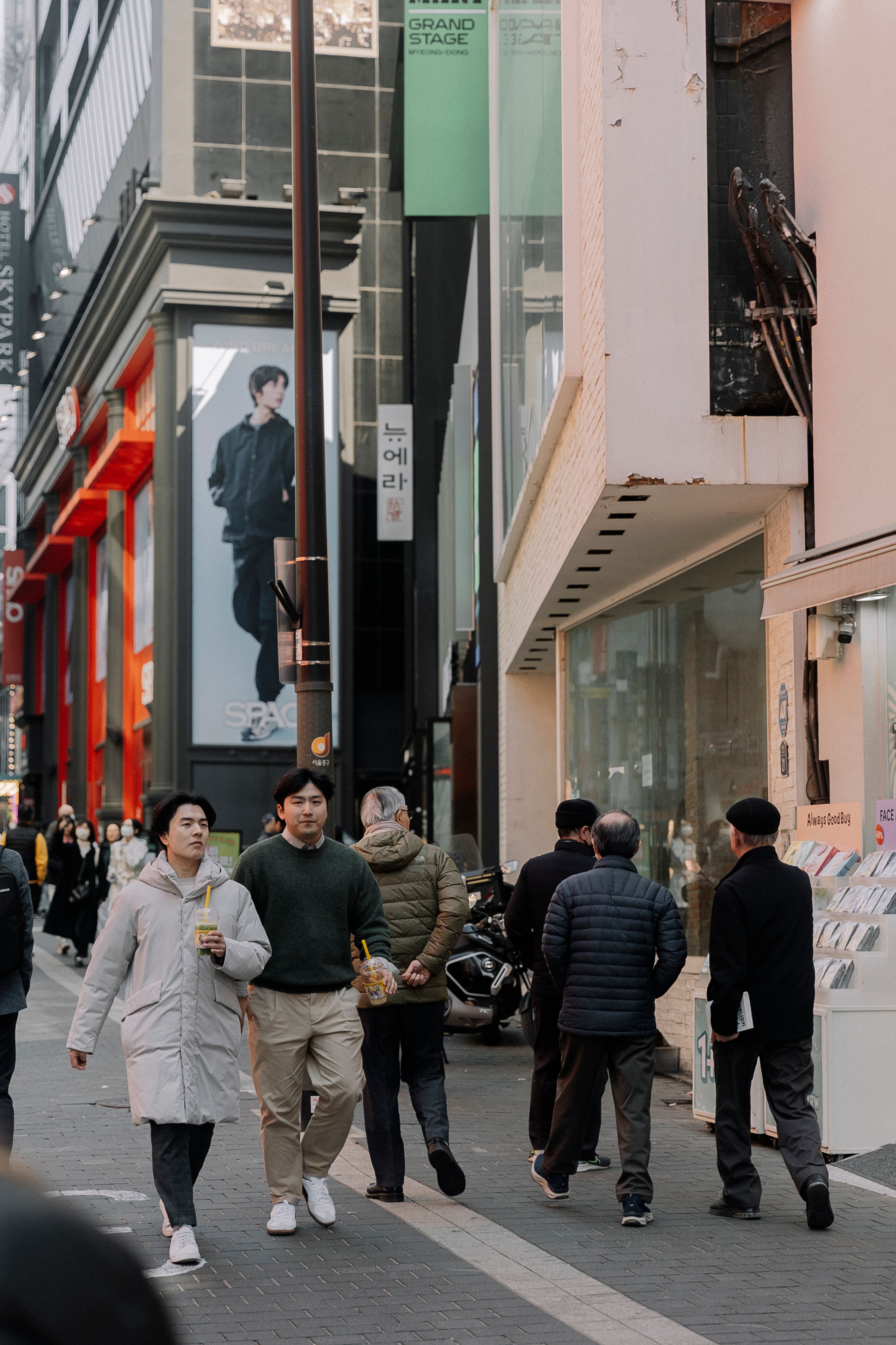 Photo of Pedestrians Walking on a Street in a City · Free Stock Photo