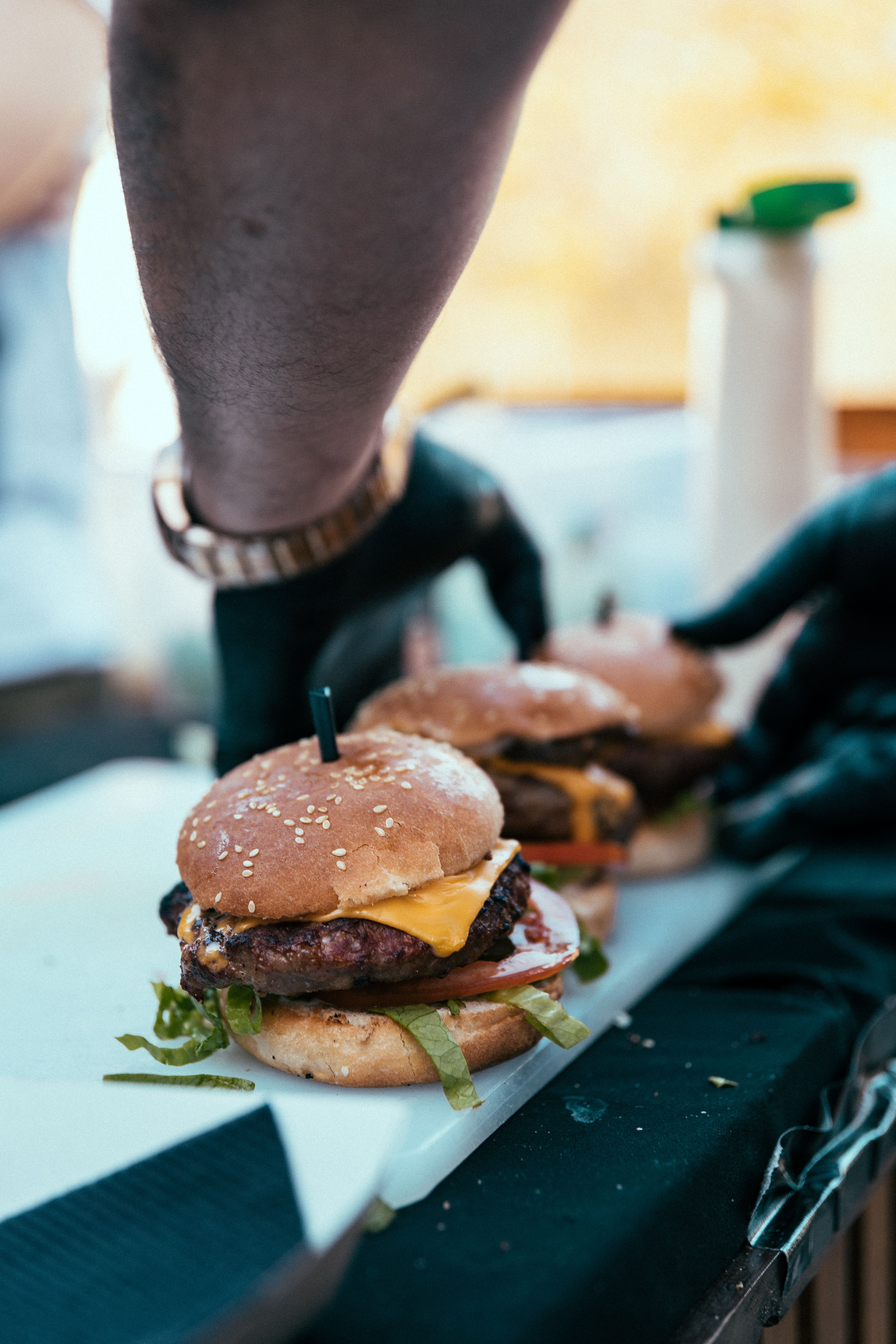 Arm of Man Preparing Burgers · Free Stock Photo