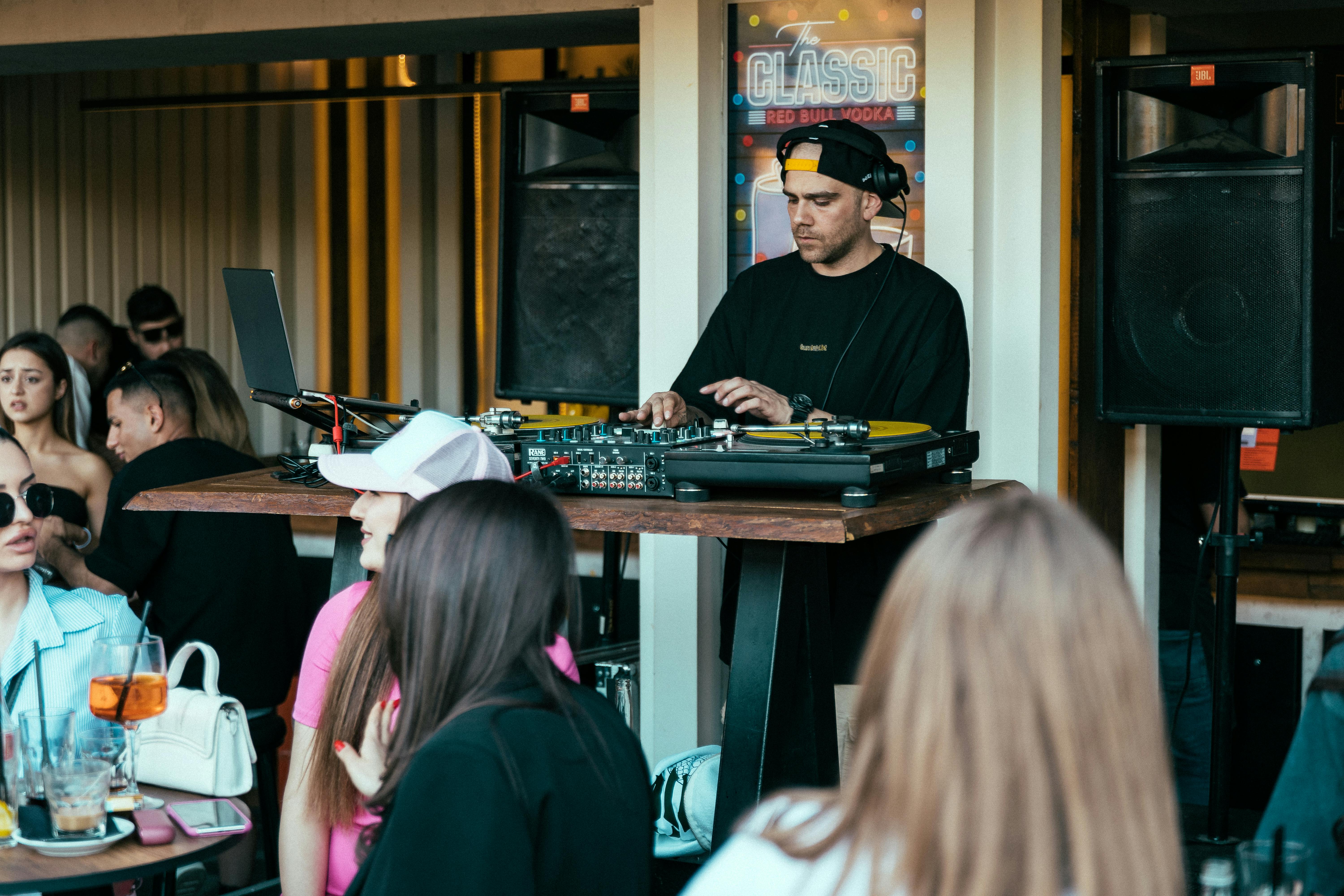 Dj at a party with people watching · Free Stock Photo