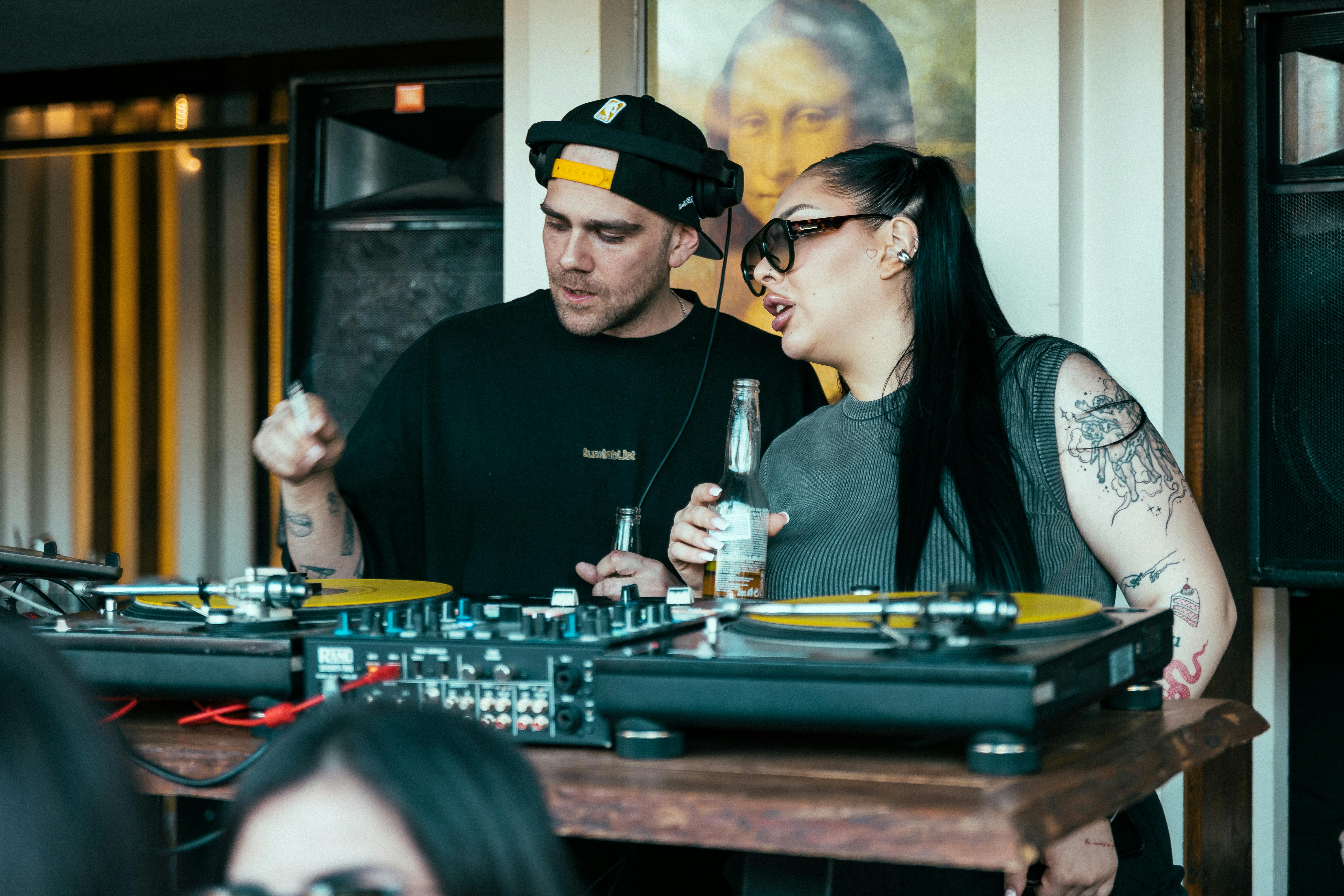 DJs Smoking and Drinking at Party · Free Stock Photo