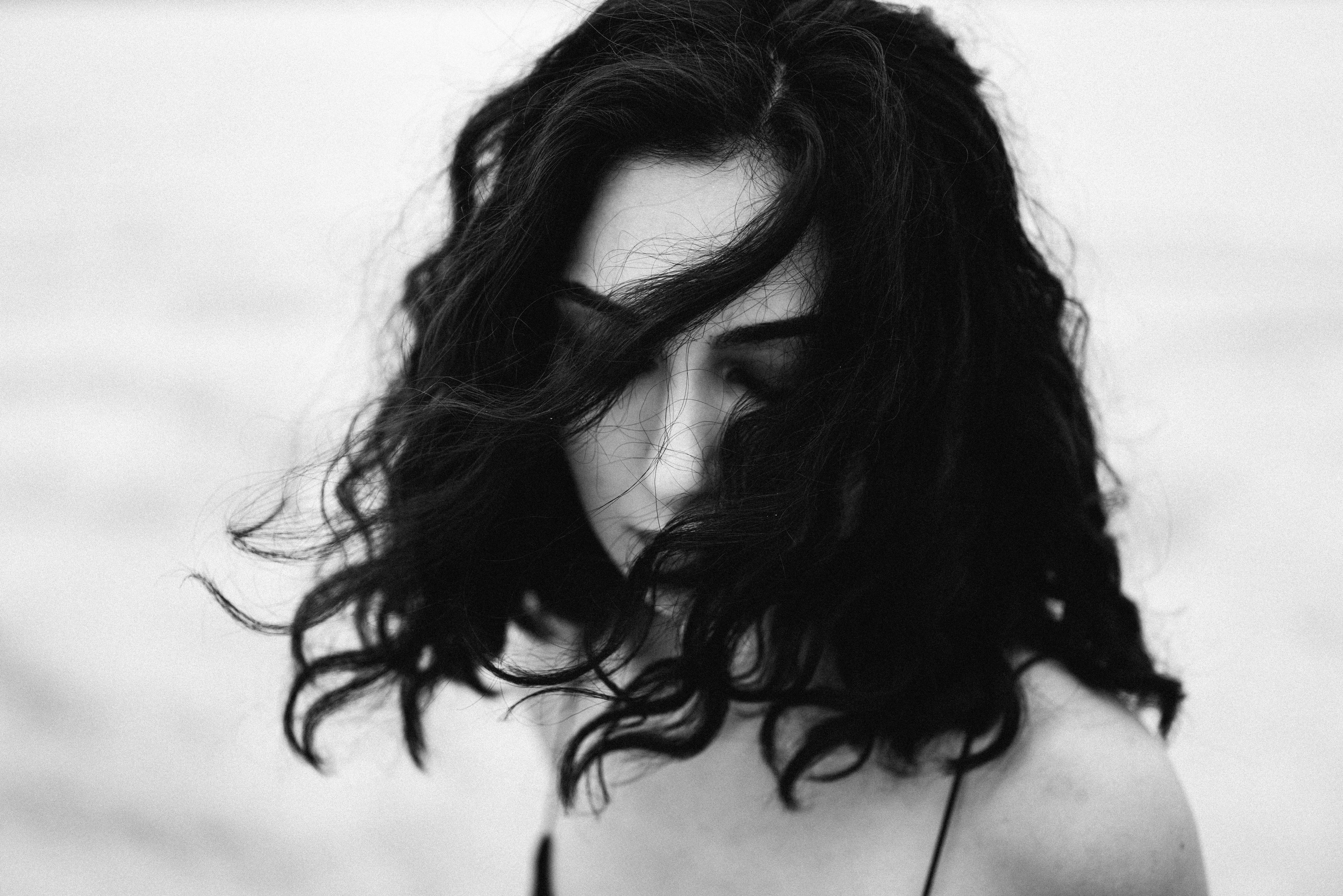 Photo of Woman Covering Face with Her Hair. · Free Stock Photo