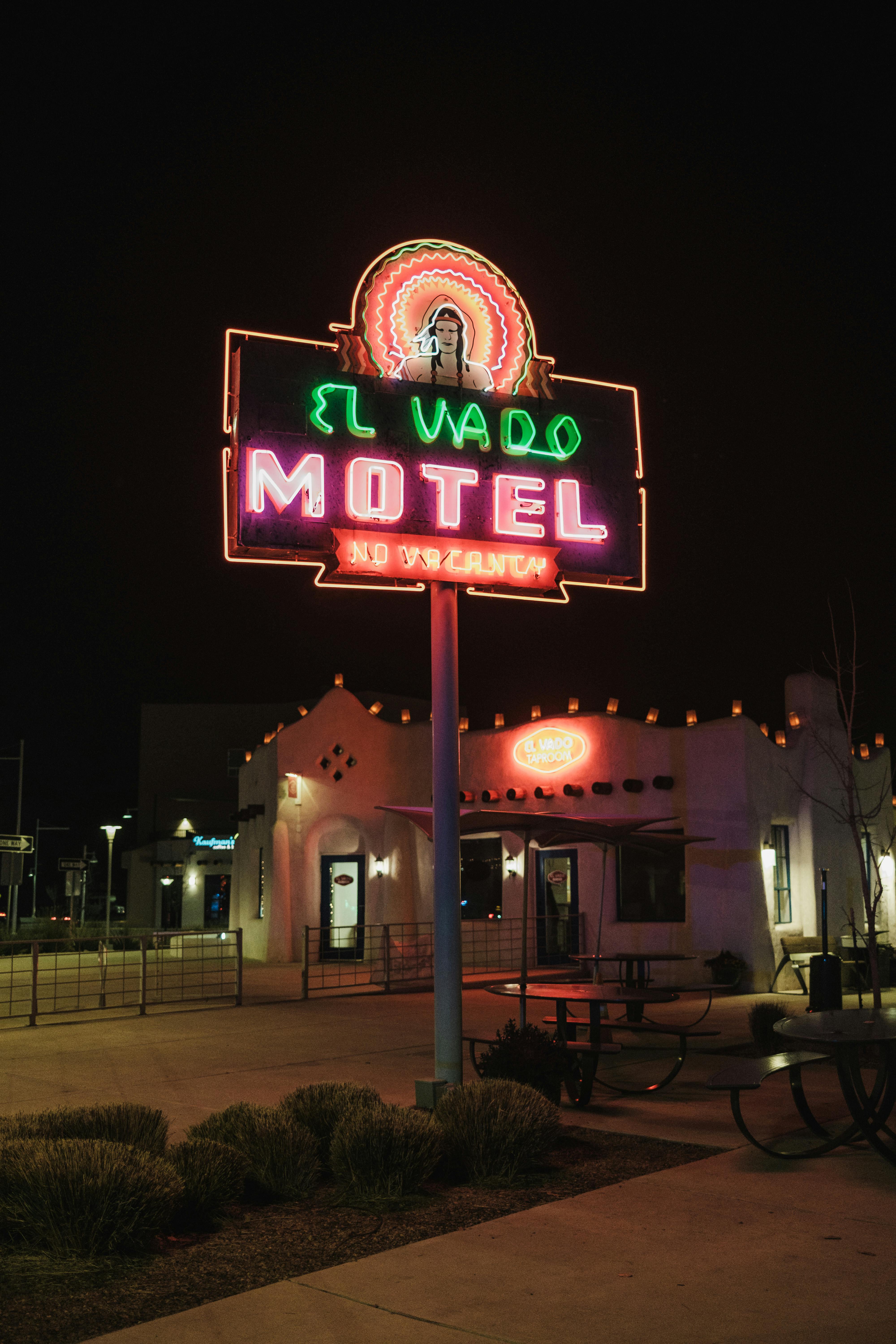 A neon sign for a motel at night · Free Stock Photo