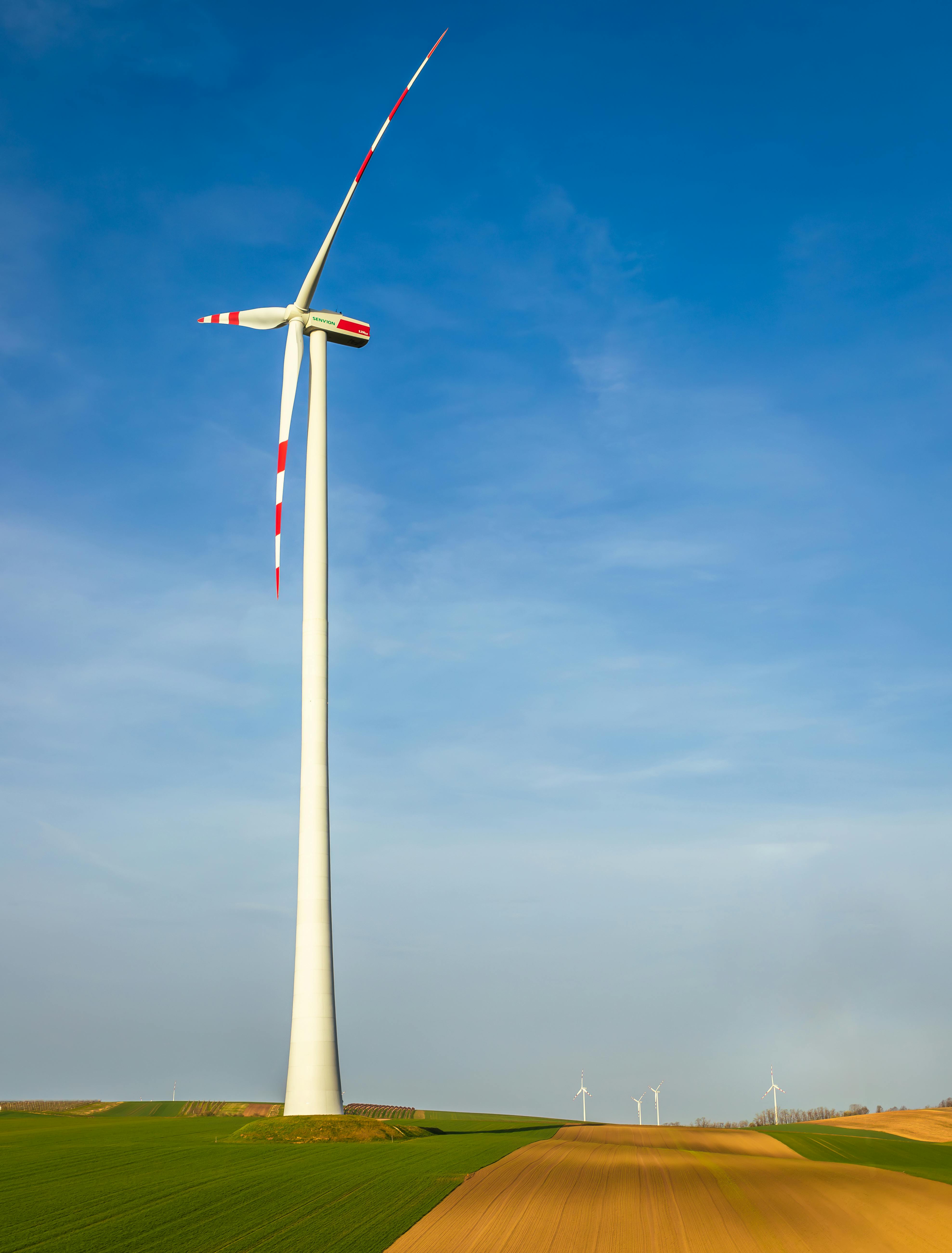 Wind Farm on Green Grass Pastures · Free Stock Photo