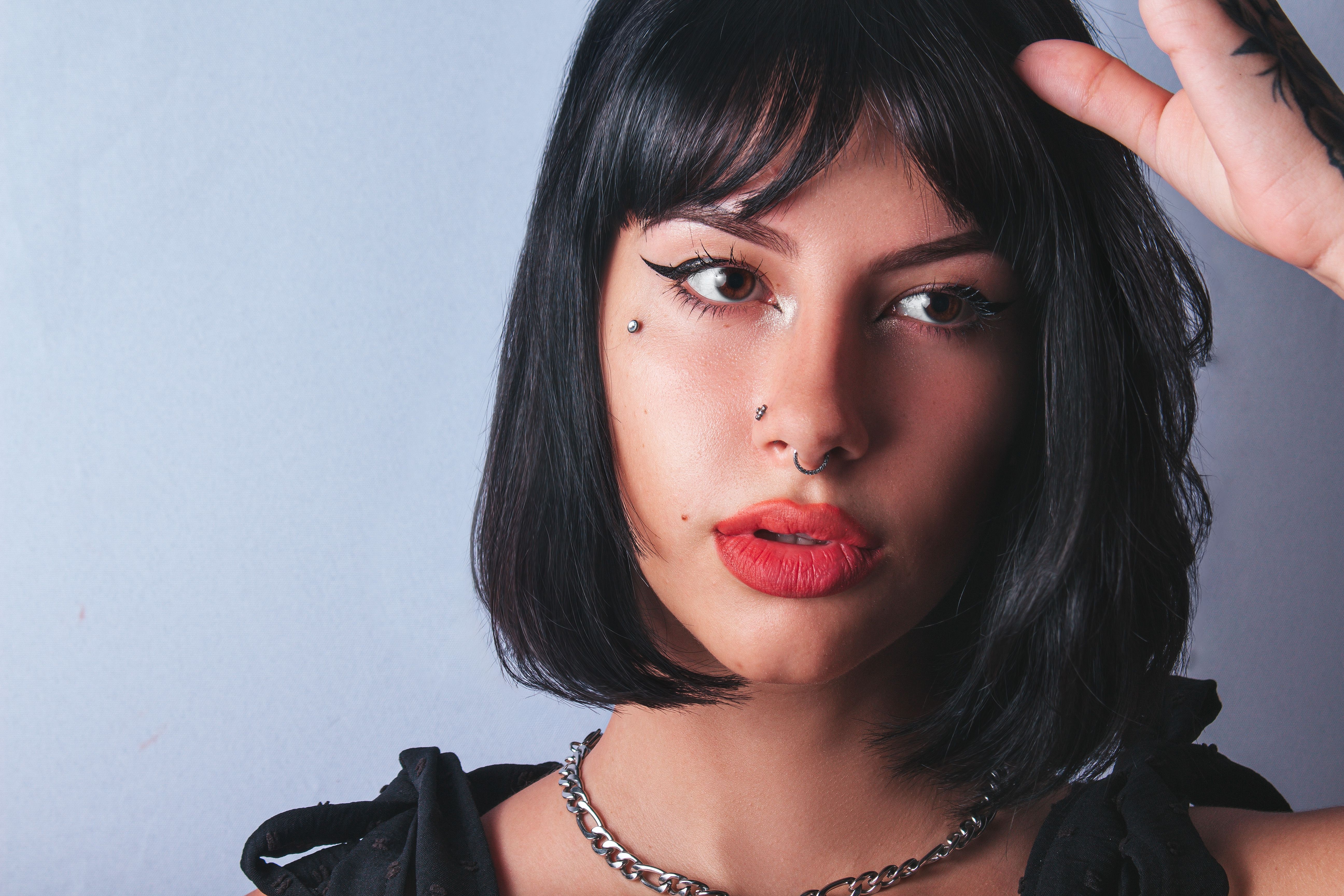 Portrait of a Young Brunette with Bangs · Free Stock Photo