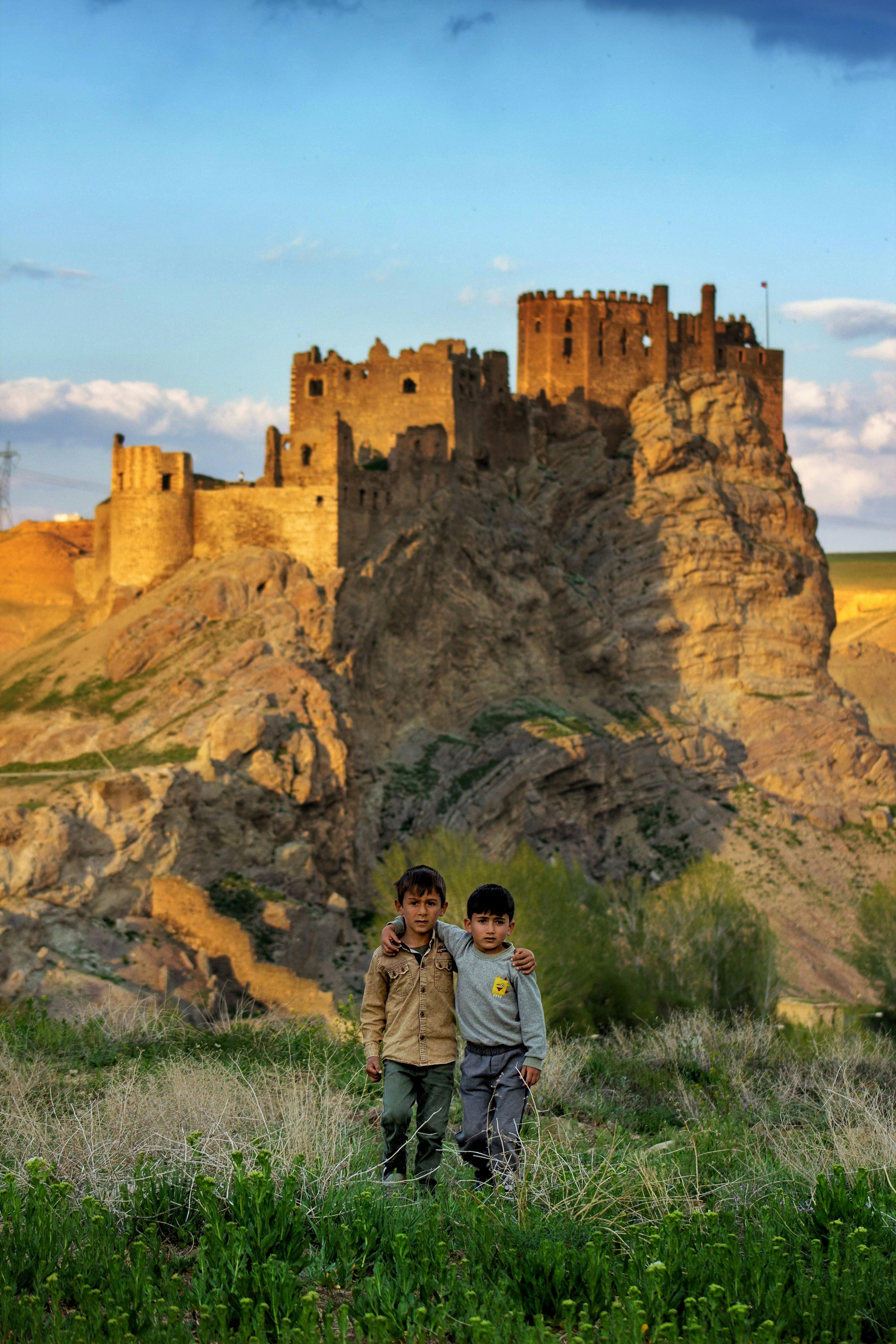 Boys Posing in Front of Van Fortress in Van in Turkey · Free Stock Photo