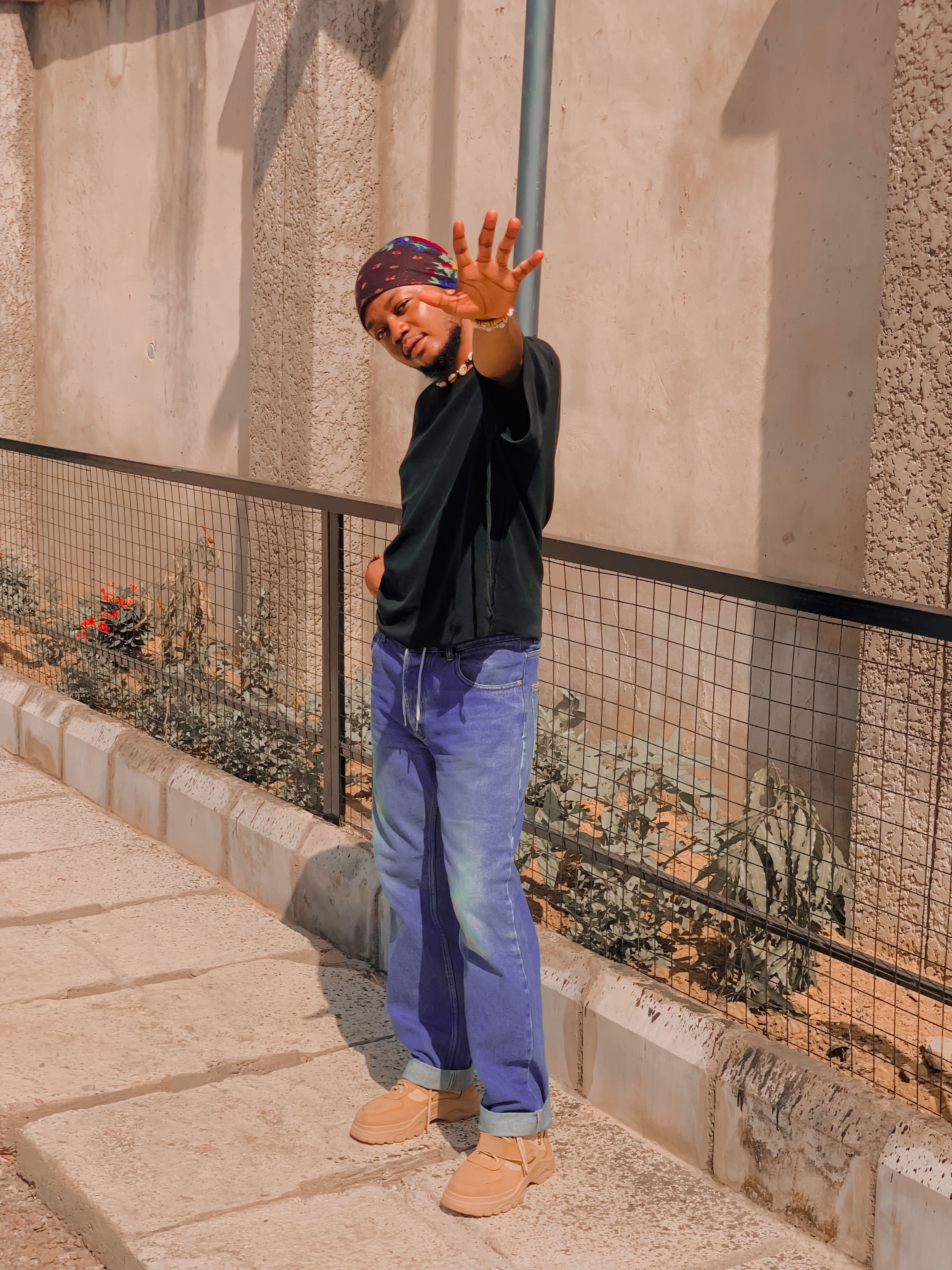 Man Posing in Front of Wall with his Hand Extended in Front · Free ...
