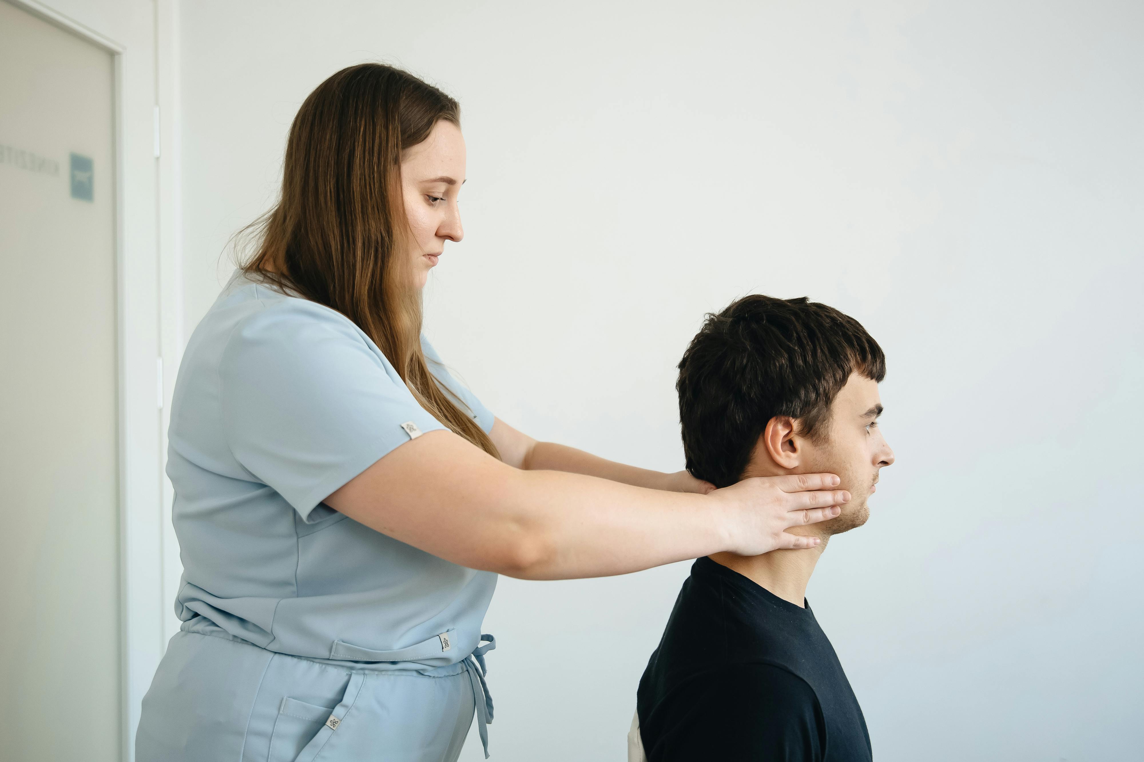 Physiotherapist Looking at Patient Back · Free Stock Photo
