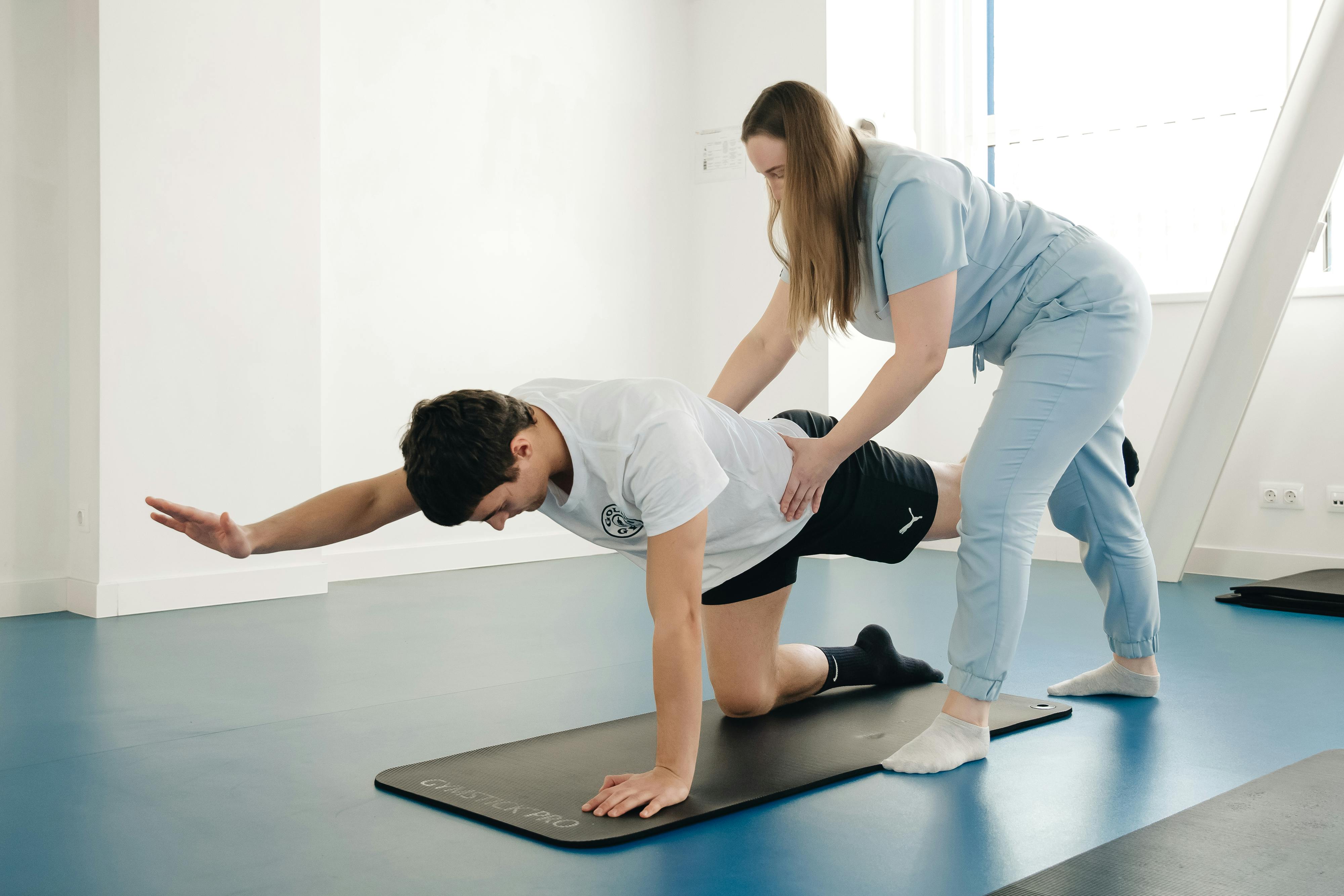 Woman Helping Patient Exercising · Free Stock Photo