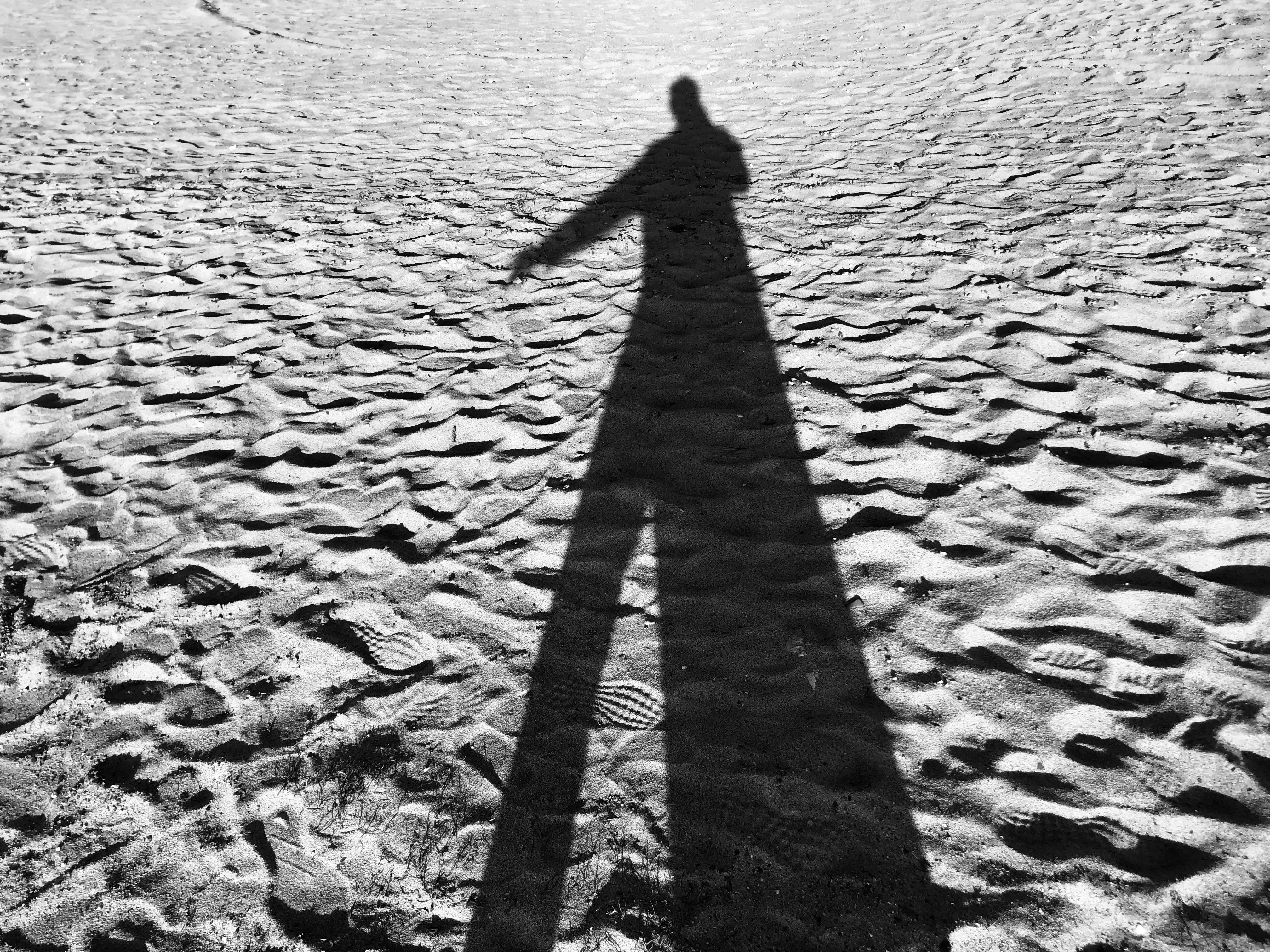 Shadow of Person Standing on Beach · Free Stock Photo