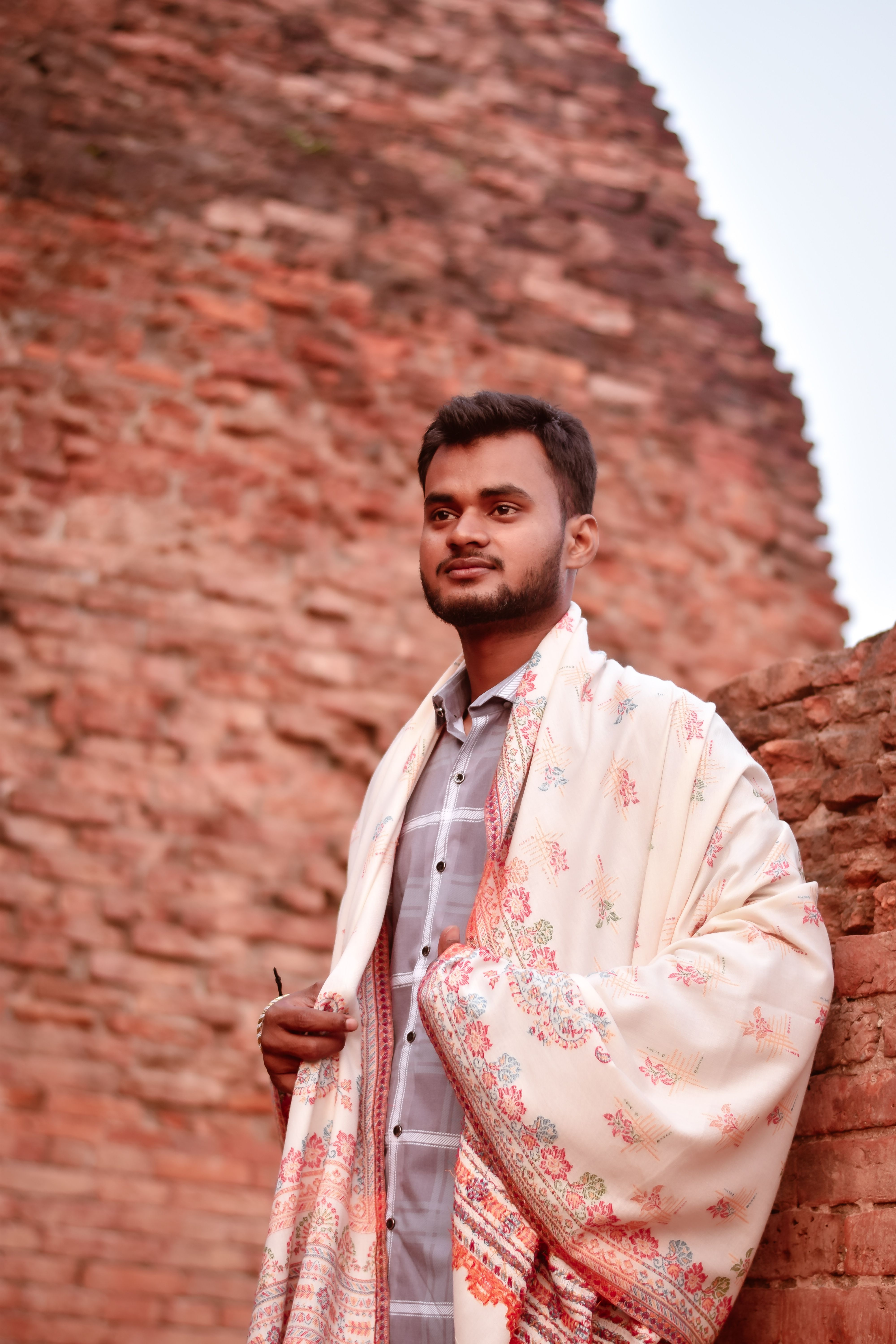 Fine-Looking Man in Traditional Gown and Shirt Posing by Bricks · Free ...