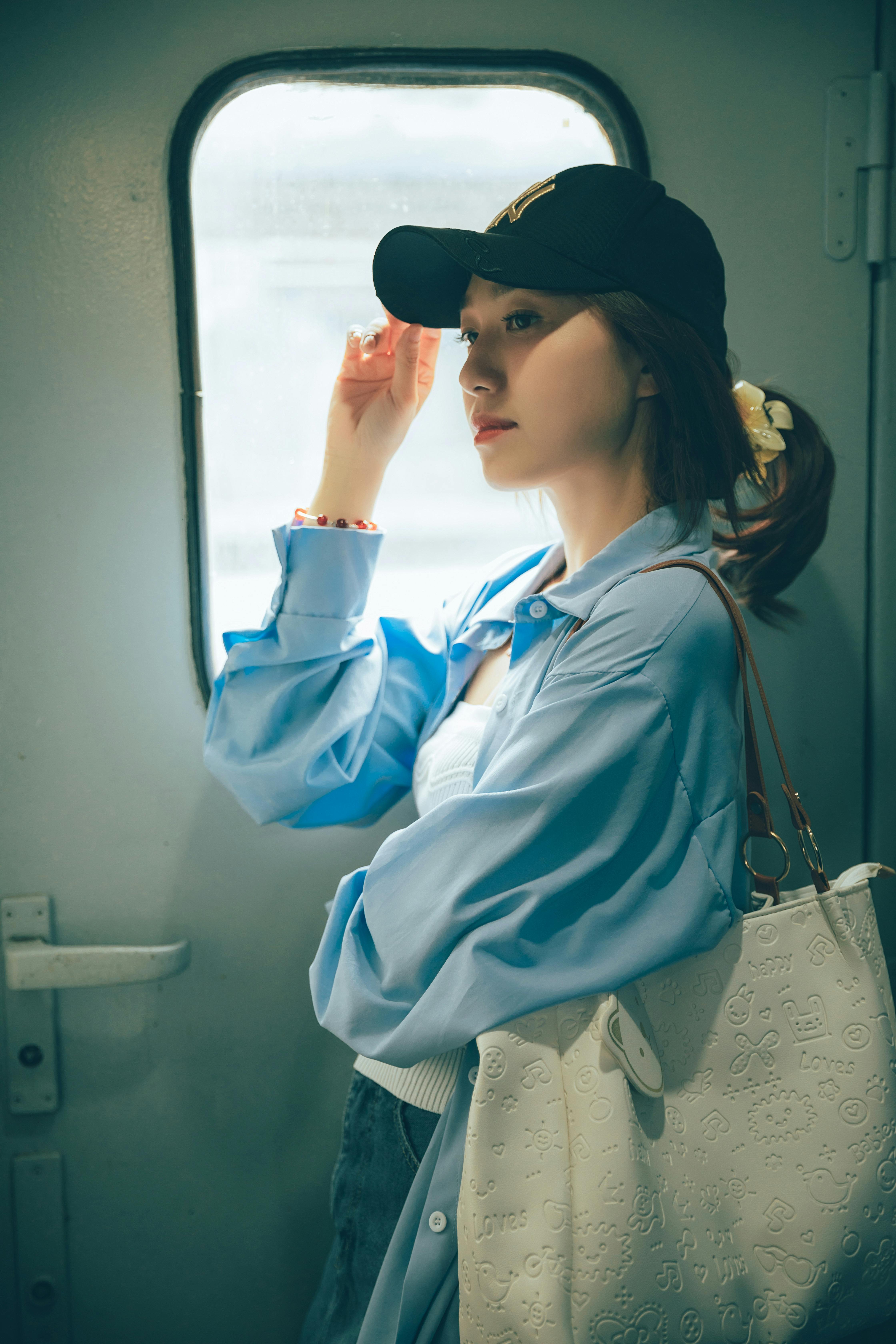 Pretty Woman in Blue Shirt Travelling by Train · Free Stock Photo