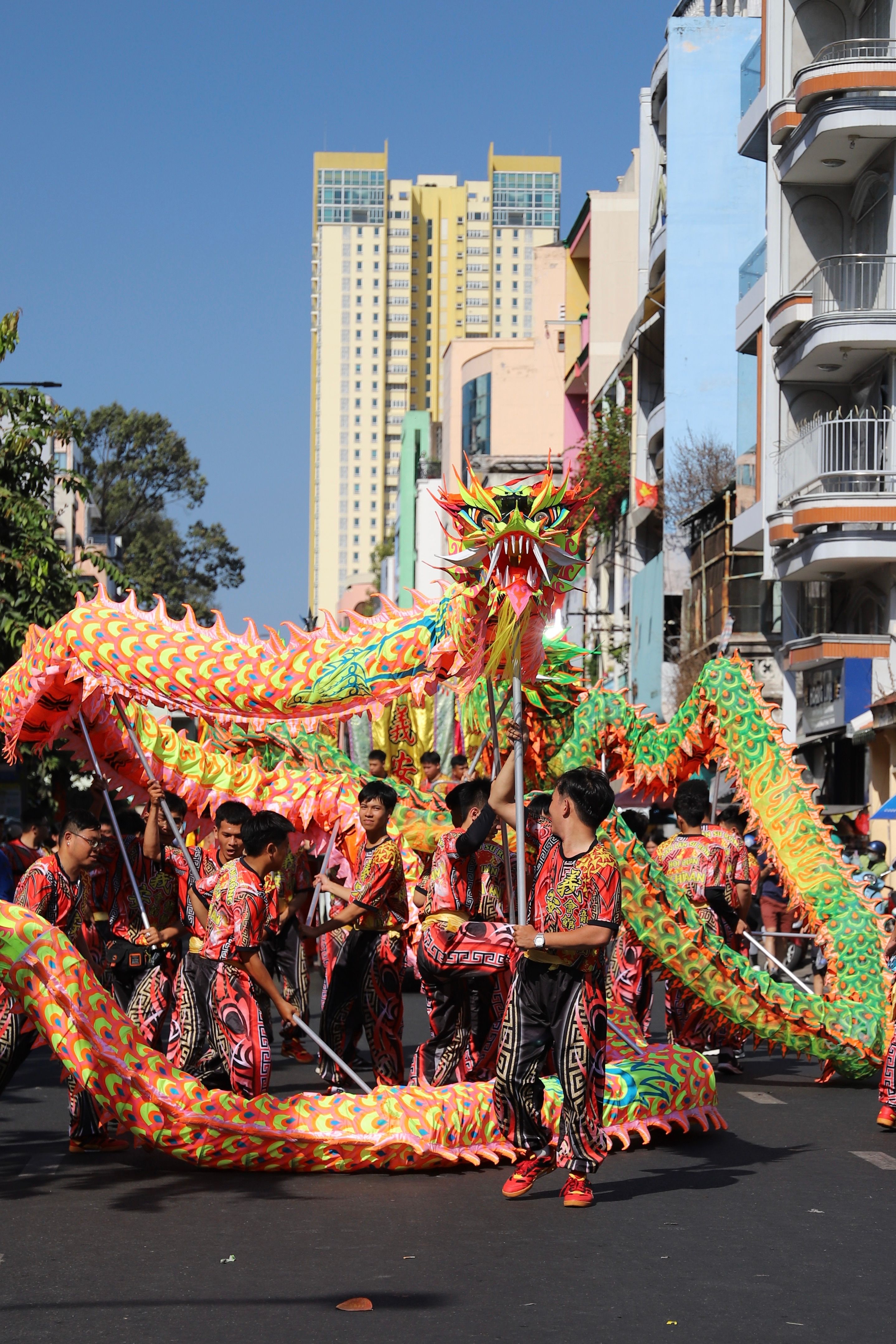 A dragon dance parade in the street · Free Stock Photo