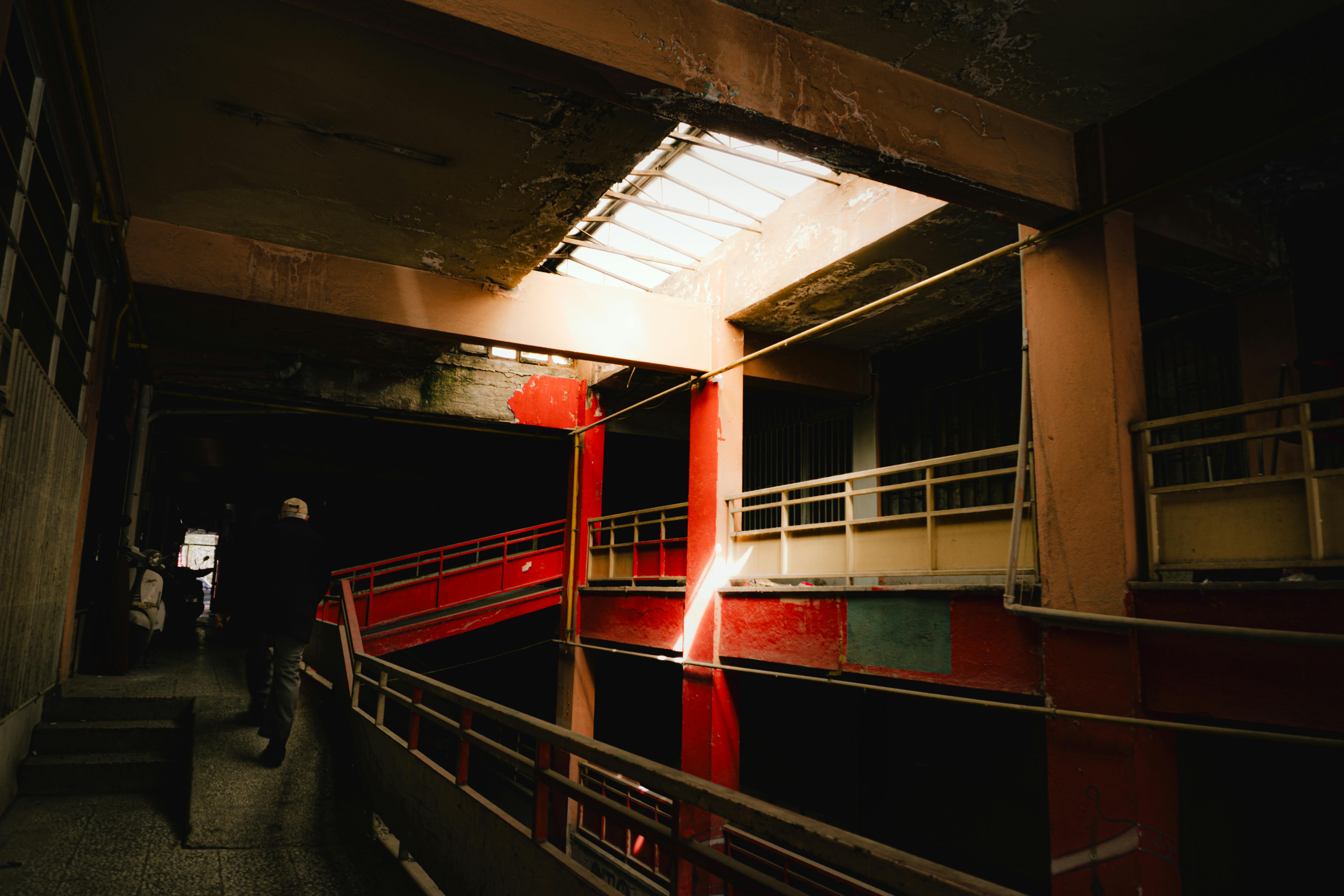 Man Walking on Mezzanine · Free Stock Photo