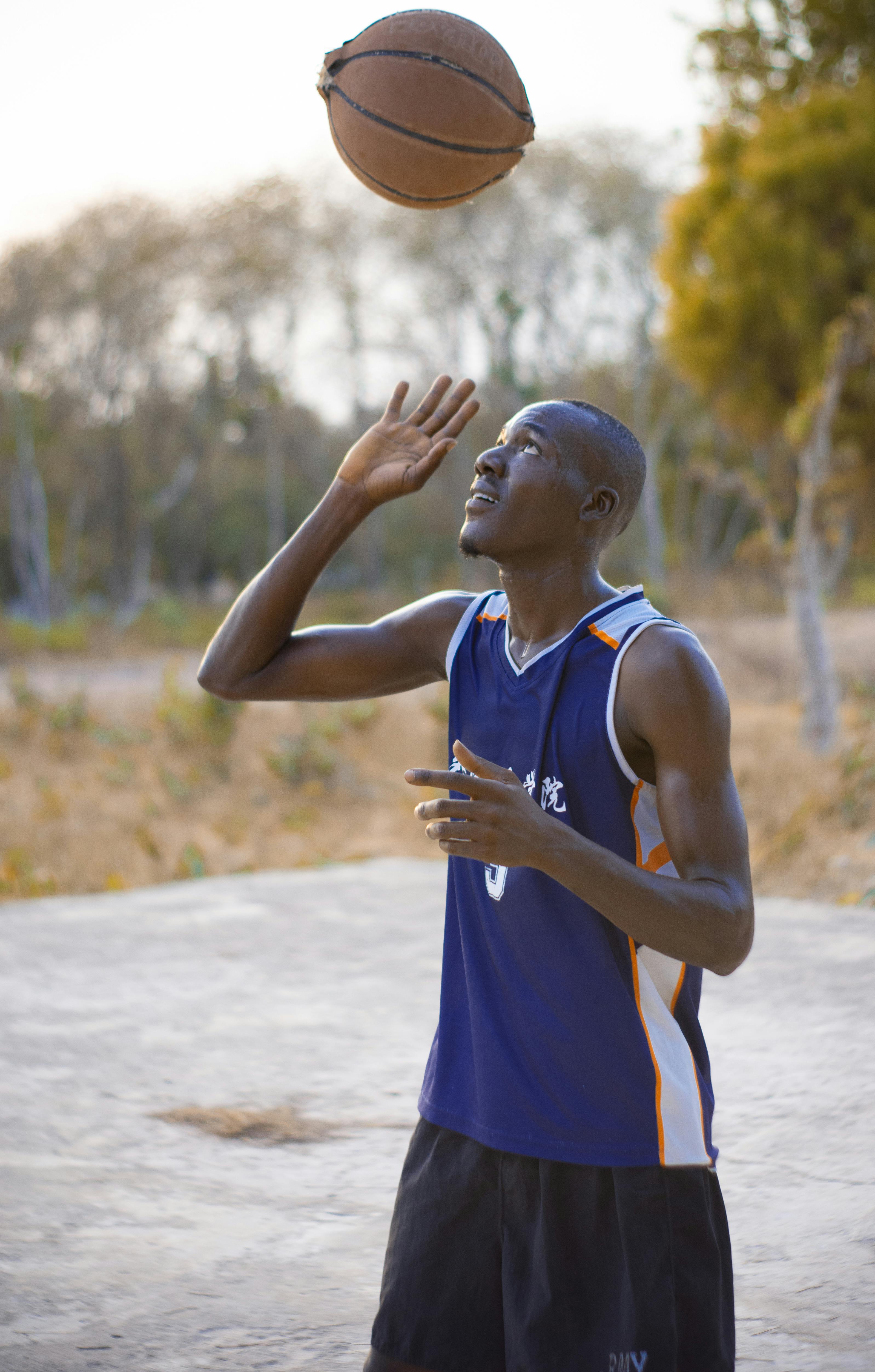 Tall Man in Tank Top Playing Basketball · Free Stock Photo