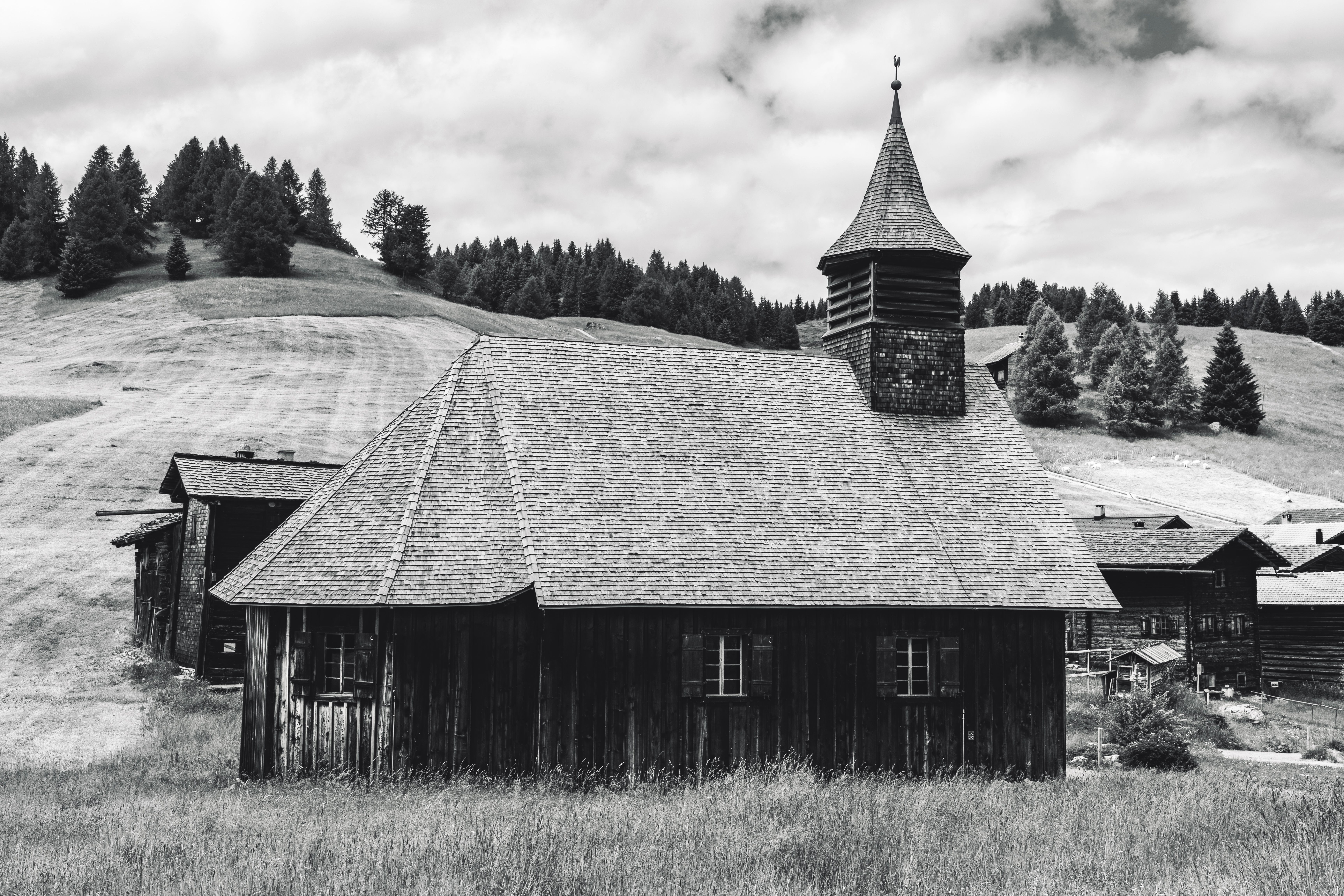 Wooden Church in a Valley in Black and White · Free Stock Photo