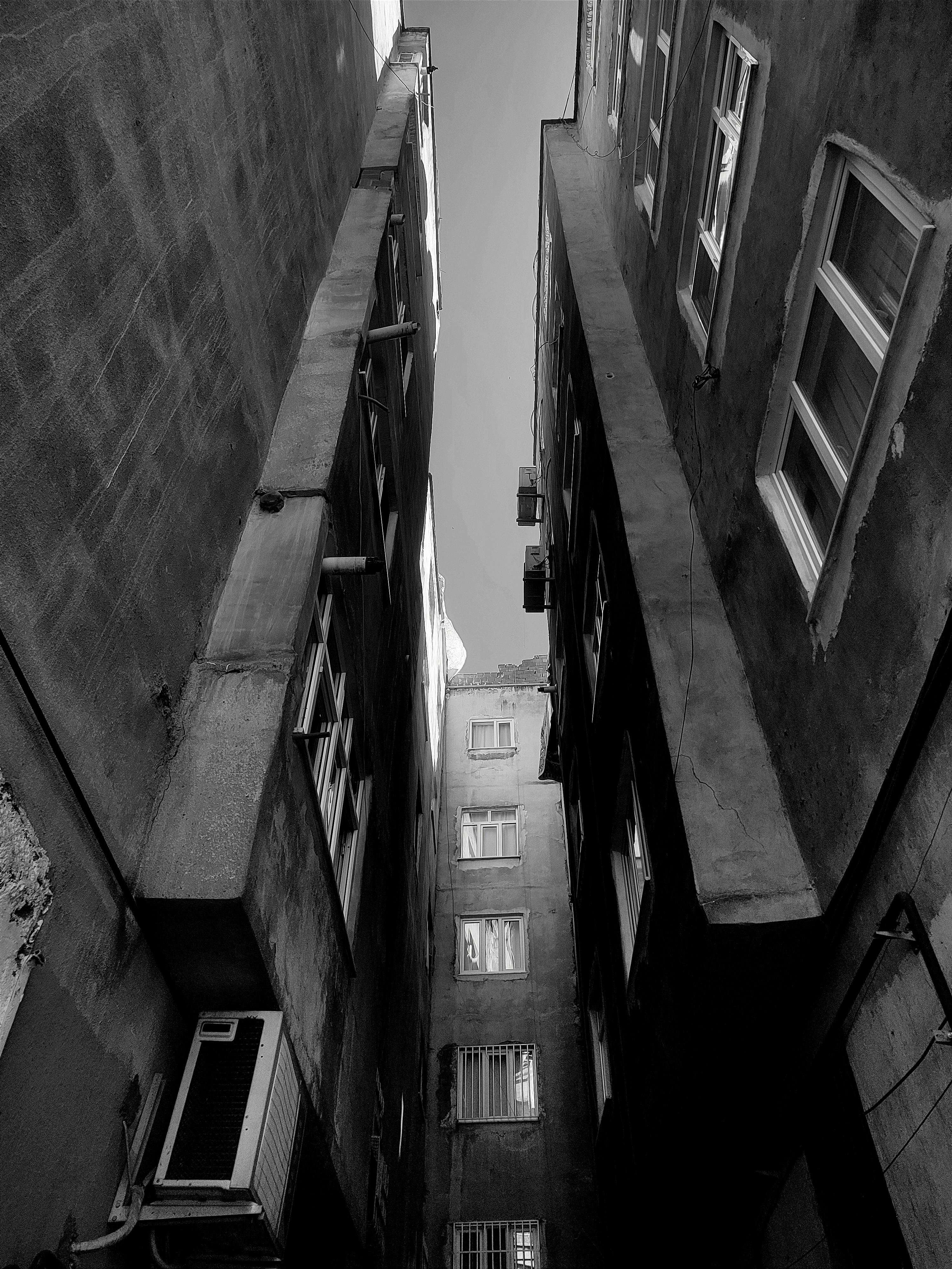 Narrow Space Between Apartment Buildings in City · Free Stock Photo