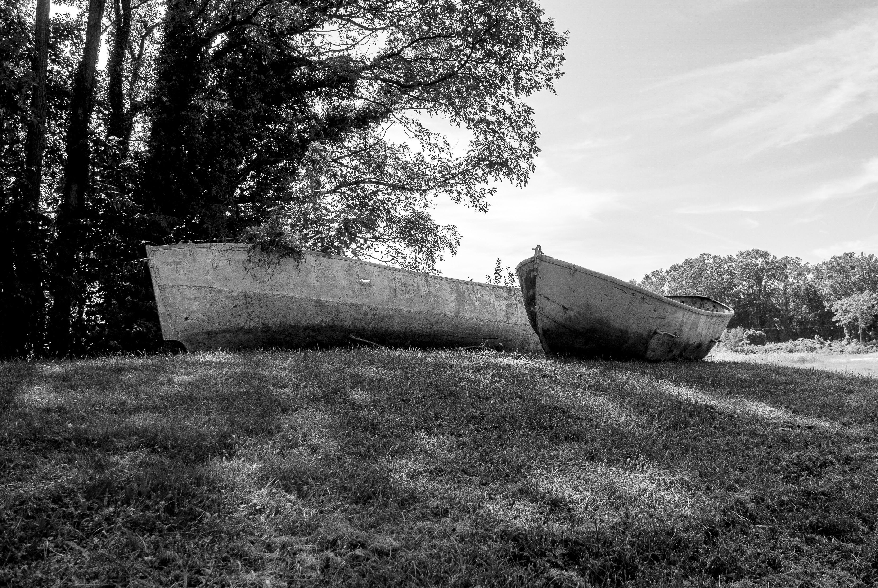 Black and White Photography of a Boats on the Grass · Free Stock Photo