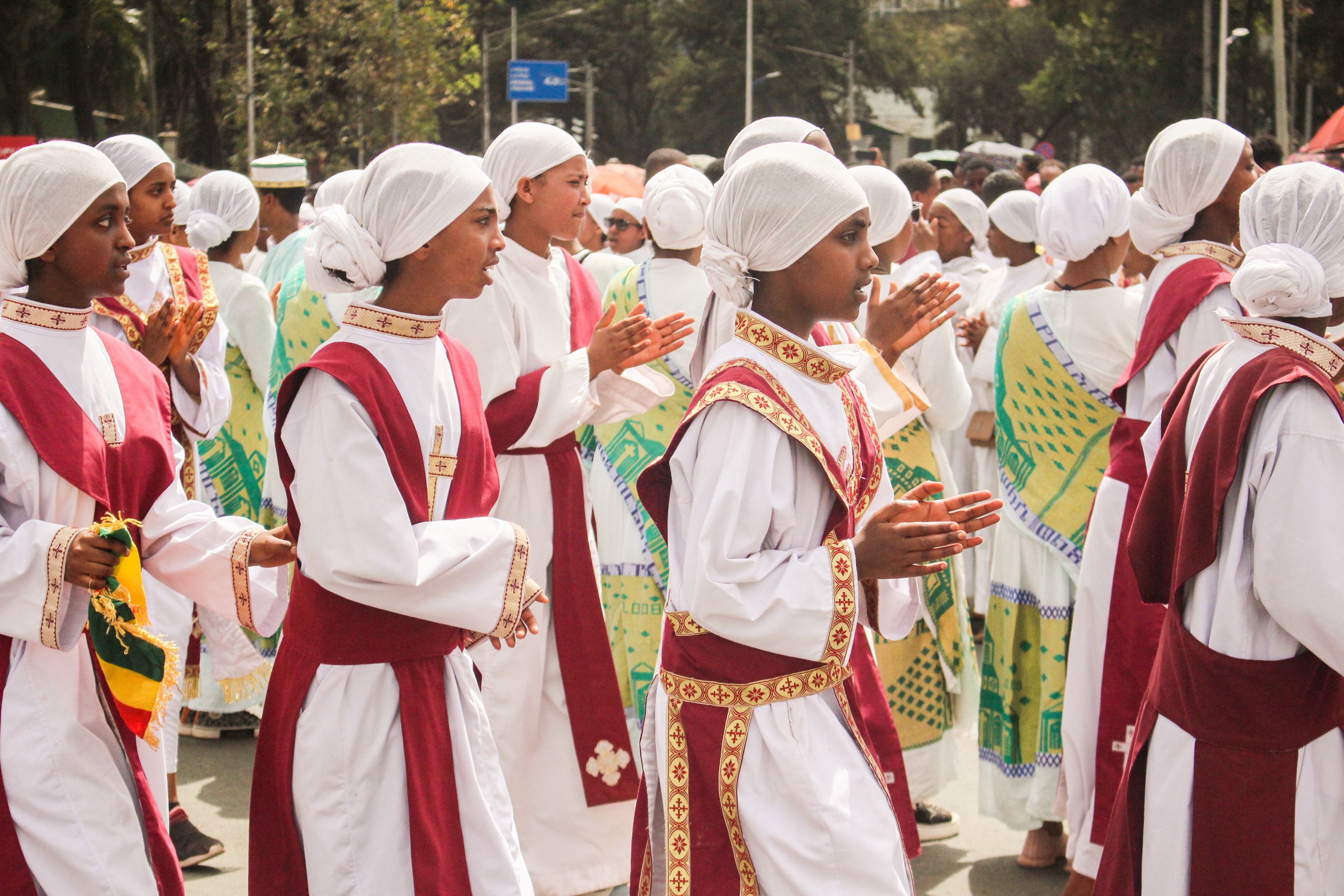 Women in Traditional Robes Walking in Parade · Free Stock Photo