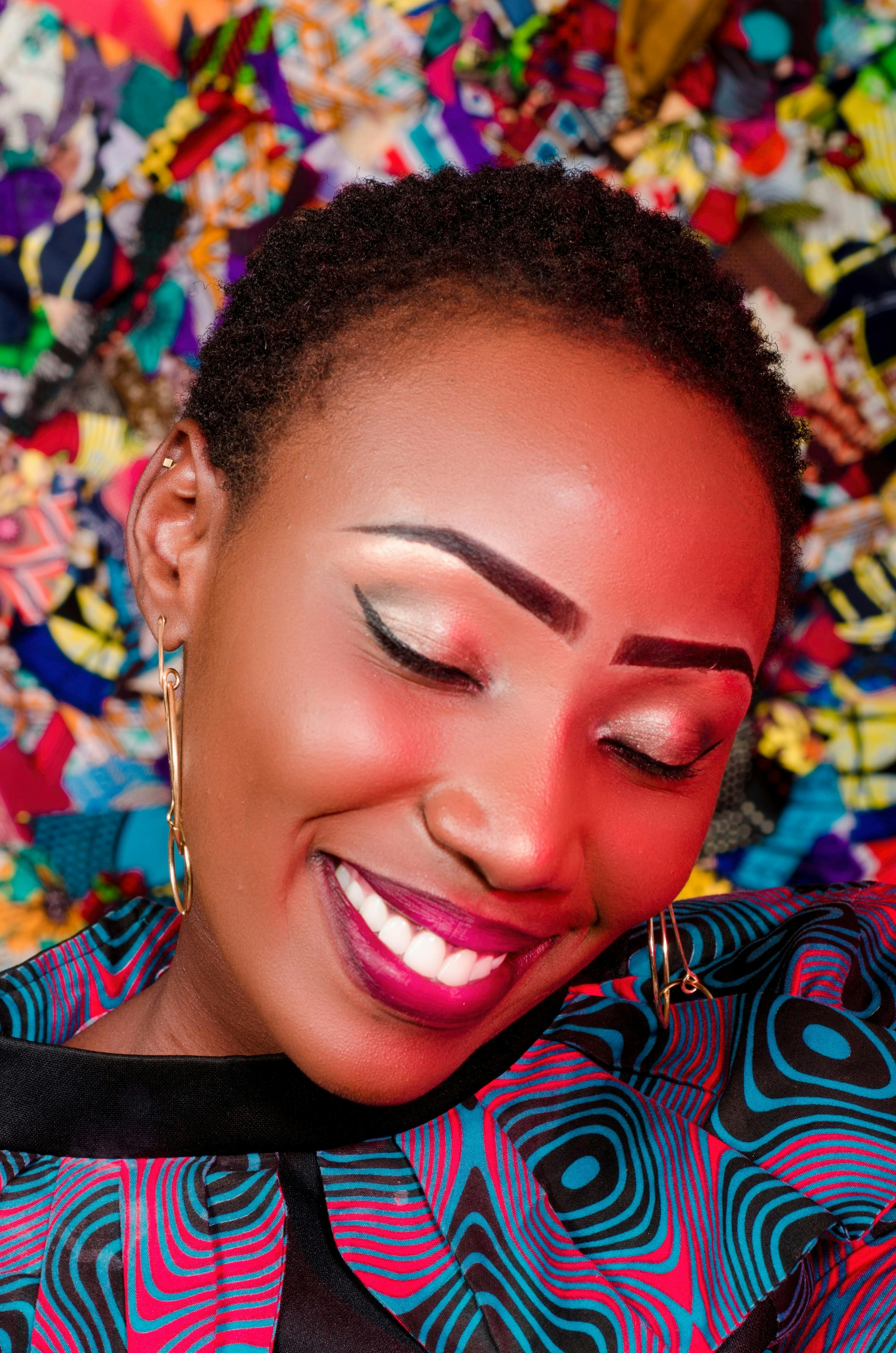 Young Woman with Closed Eyes and a Smile on her Face · Free Stock Photo